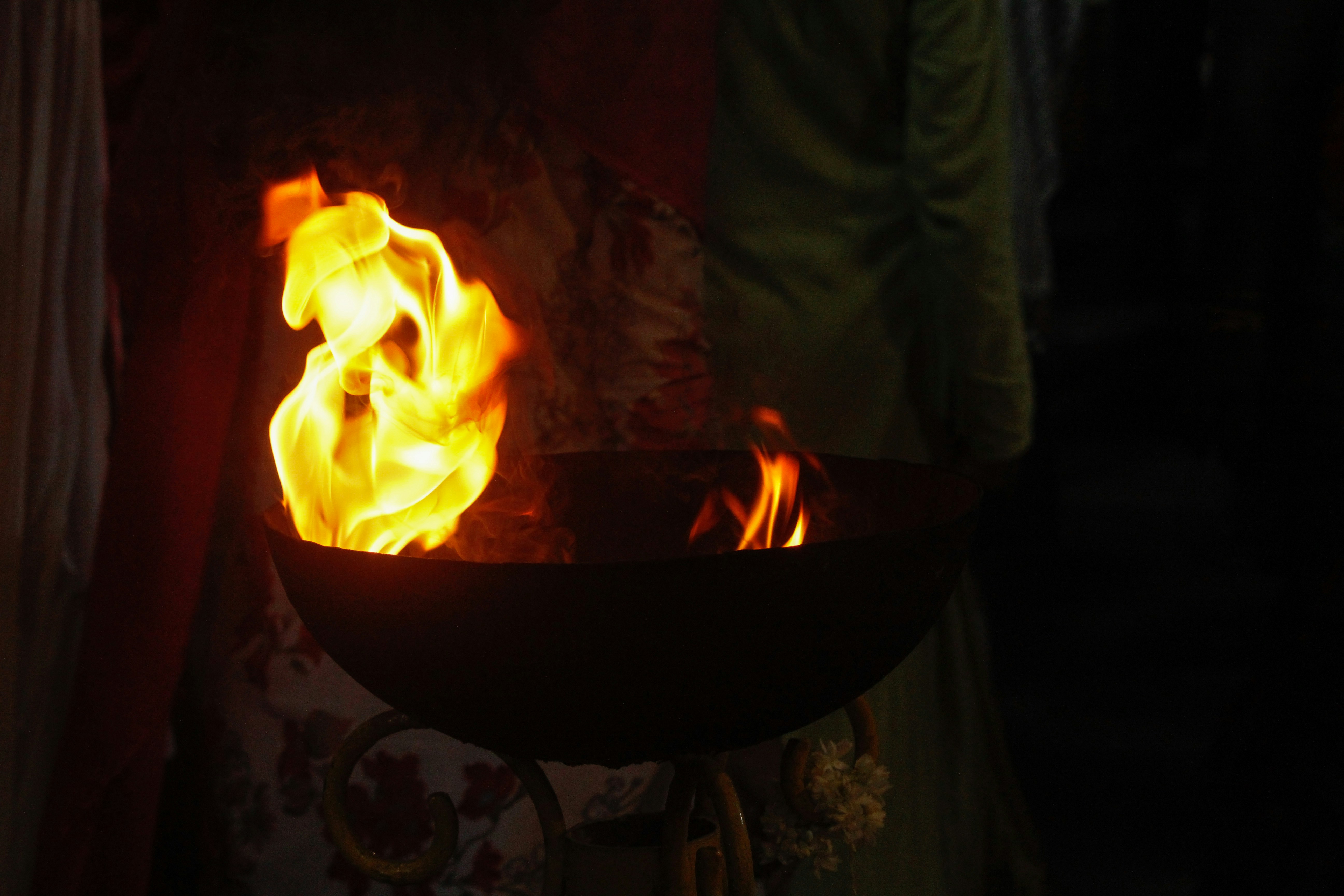 Flame in the Bowl: Quiet Firelight Amid Evening Shadows
