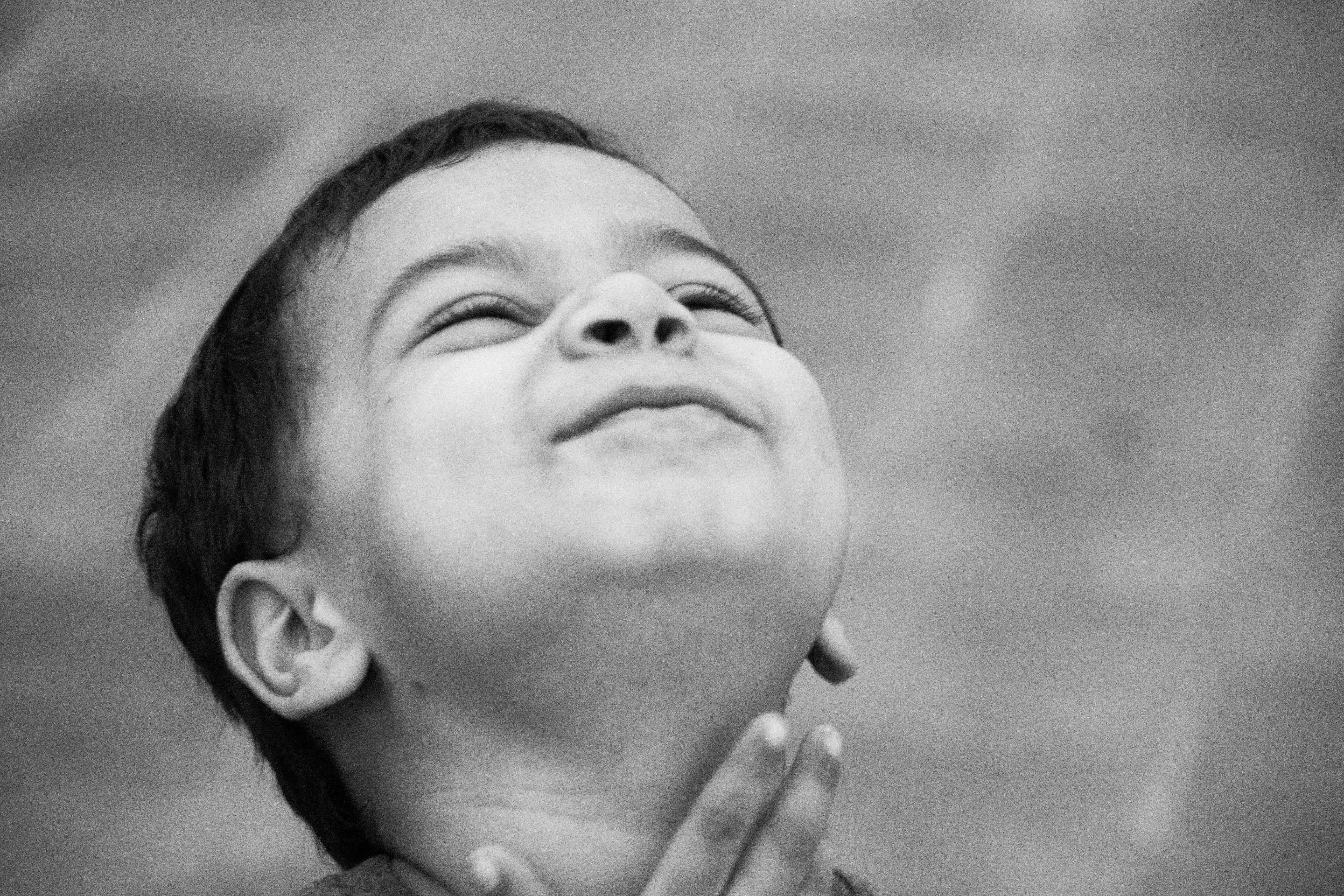 Joyful Upward Gaze: a child's radiant smile