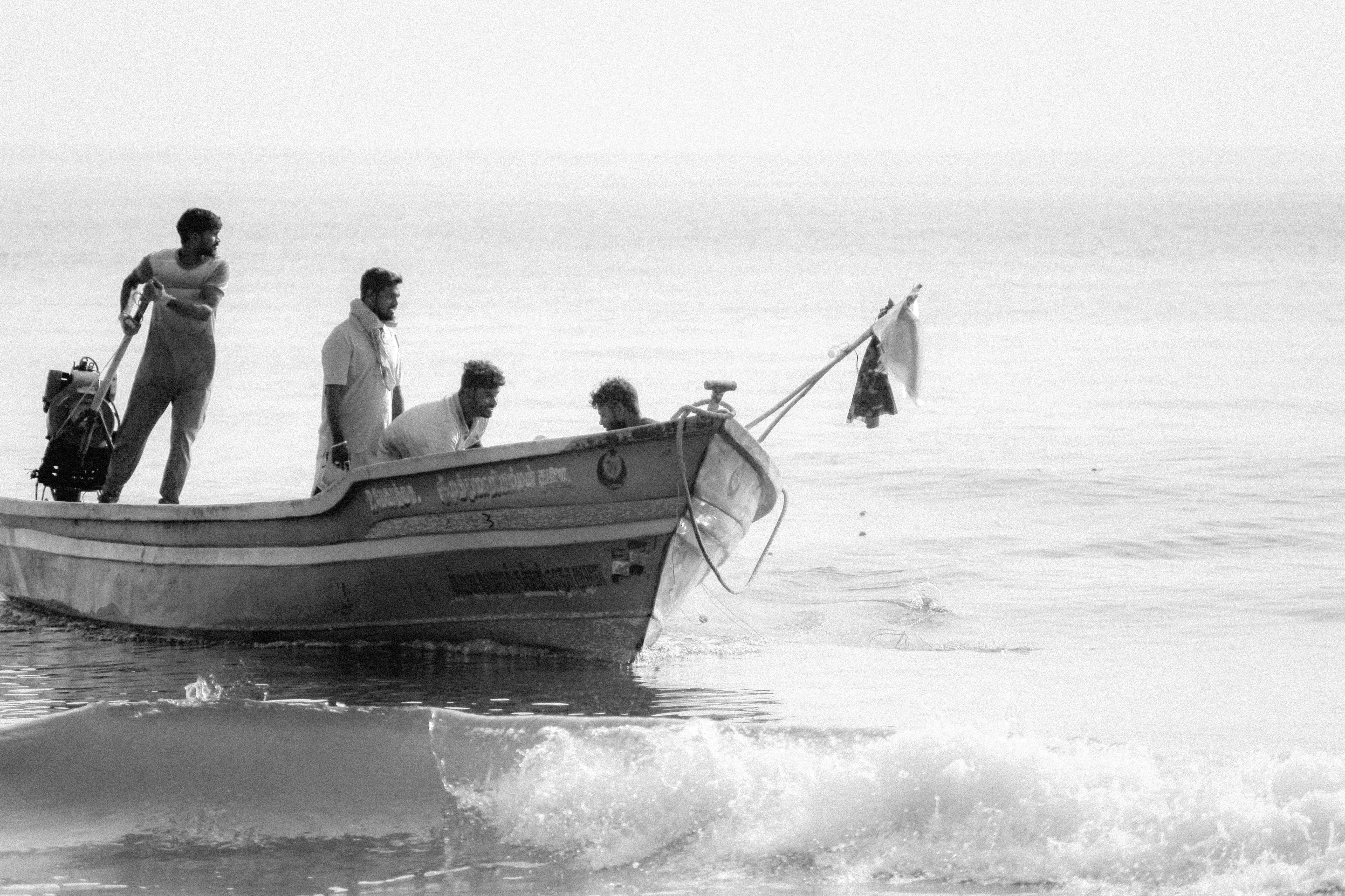Boatload of Faces on a Calm Horizon
