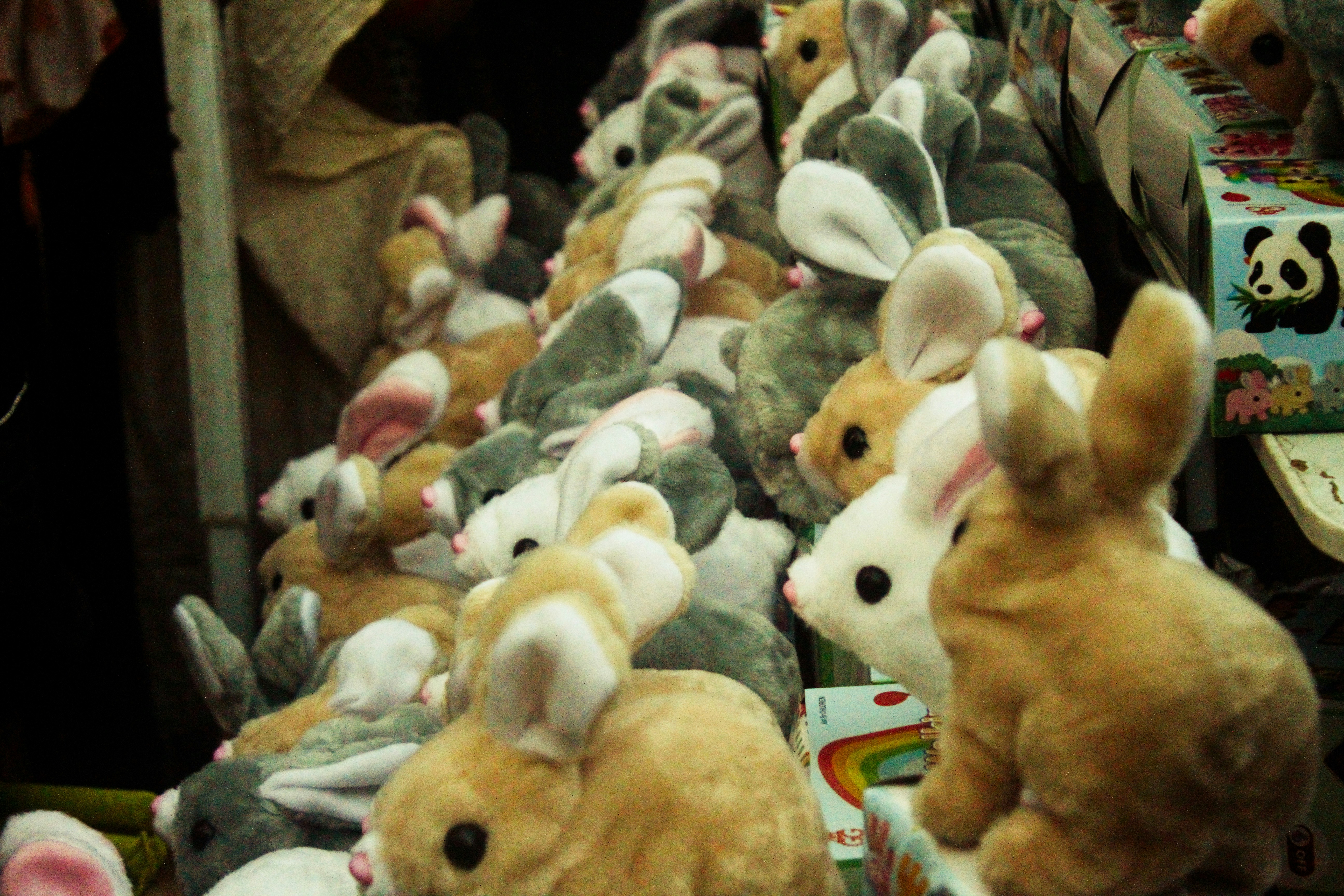 Ornate Plush Parade: A Storm of Bunnies in a Toy Stack
