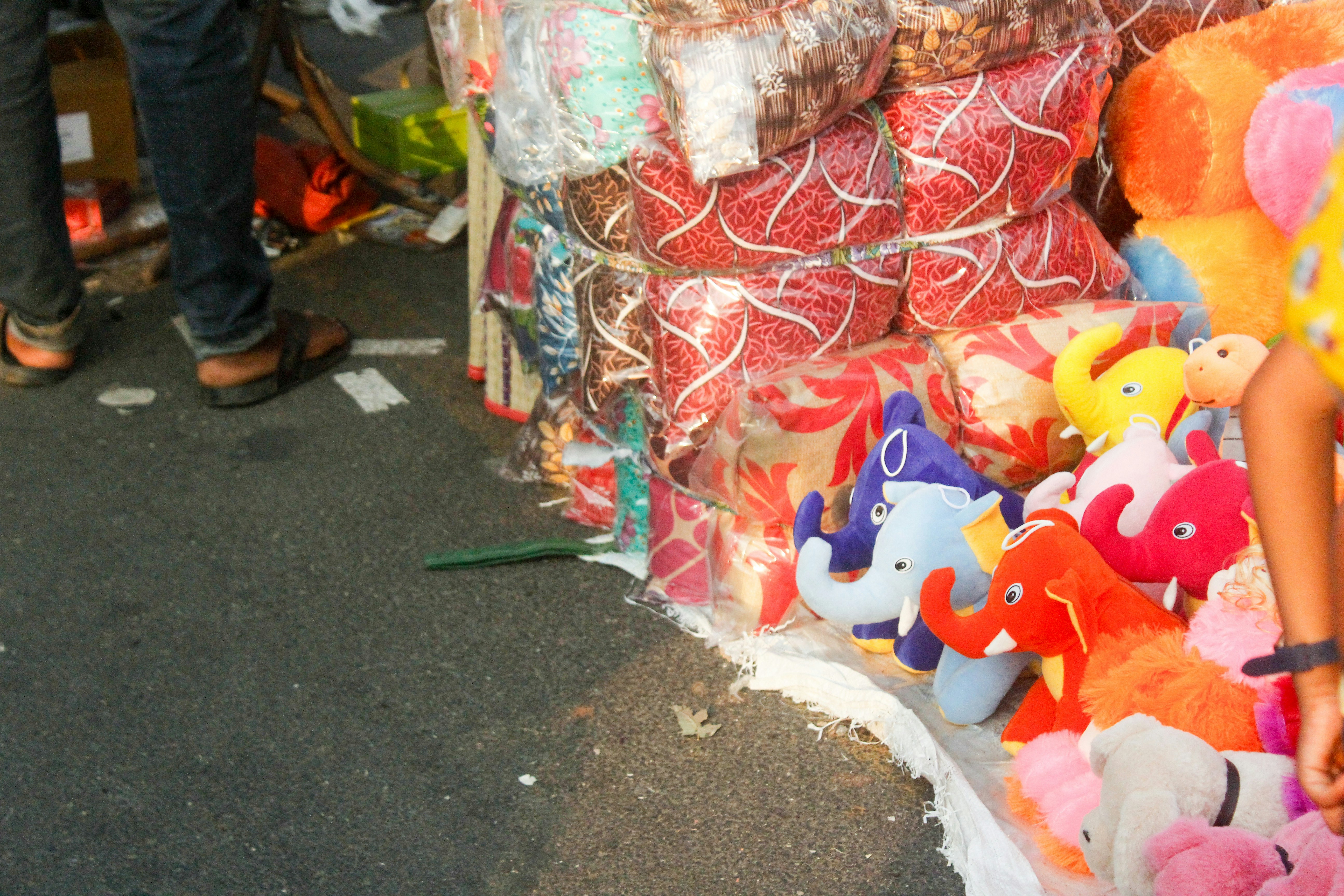 Colorful Parade of Plushes at a Street Vendor Stall