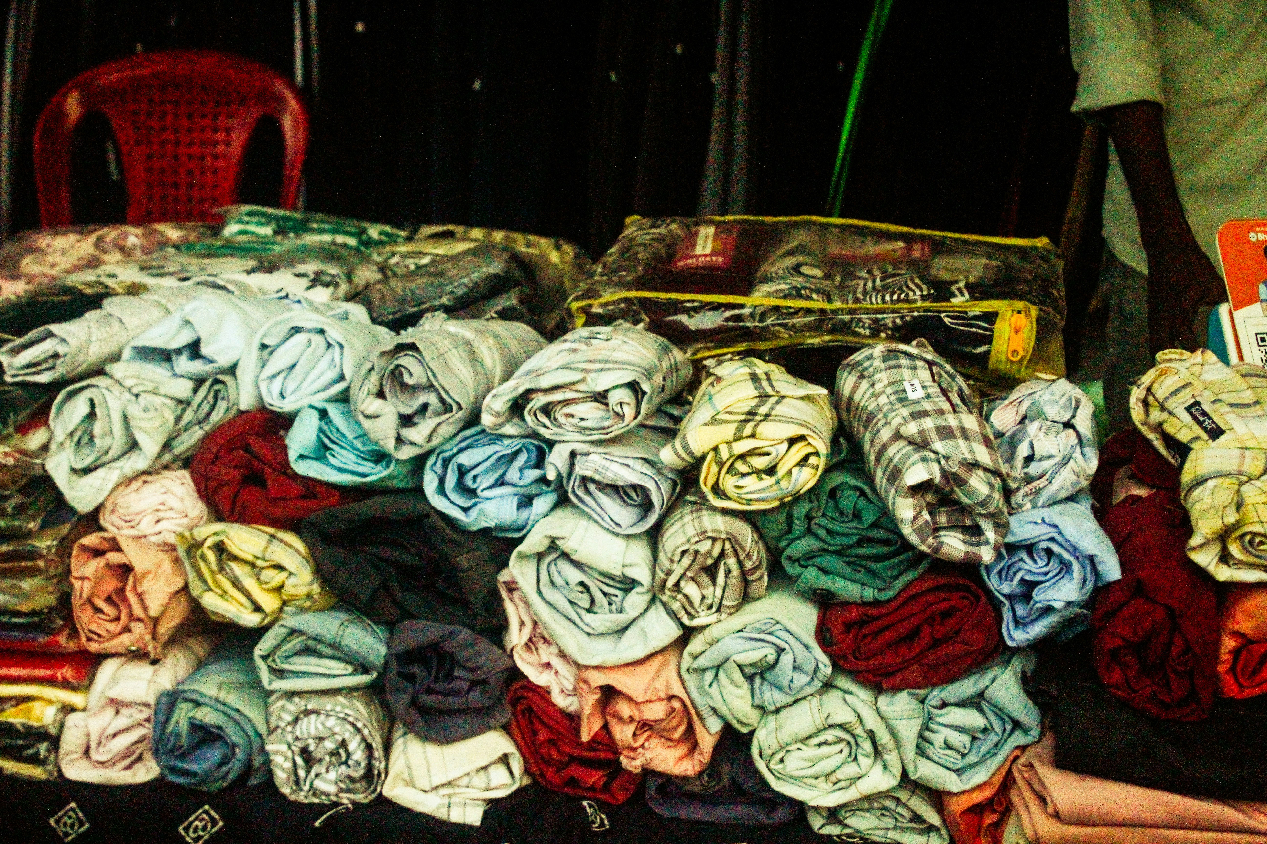 Colorful Rolled Fabric Cascade on a Market Table