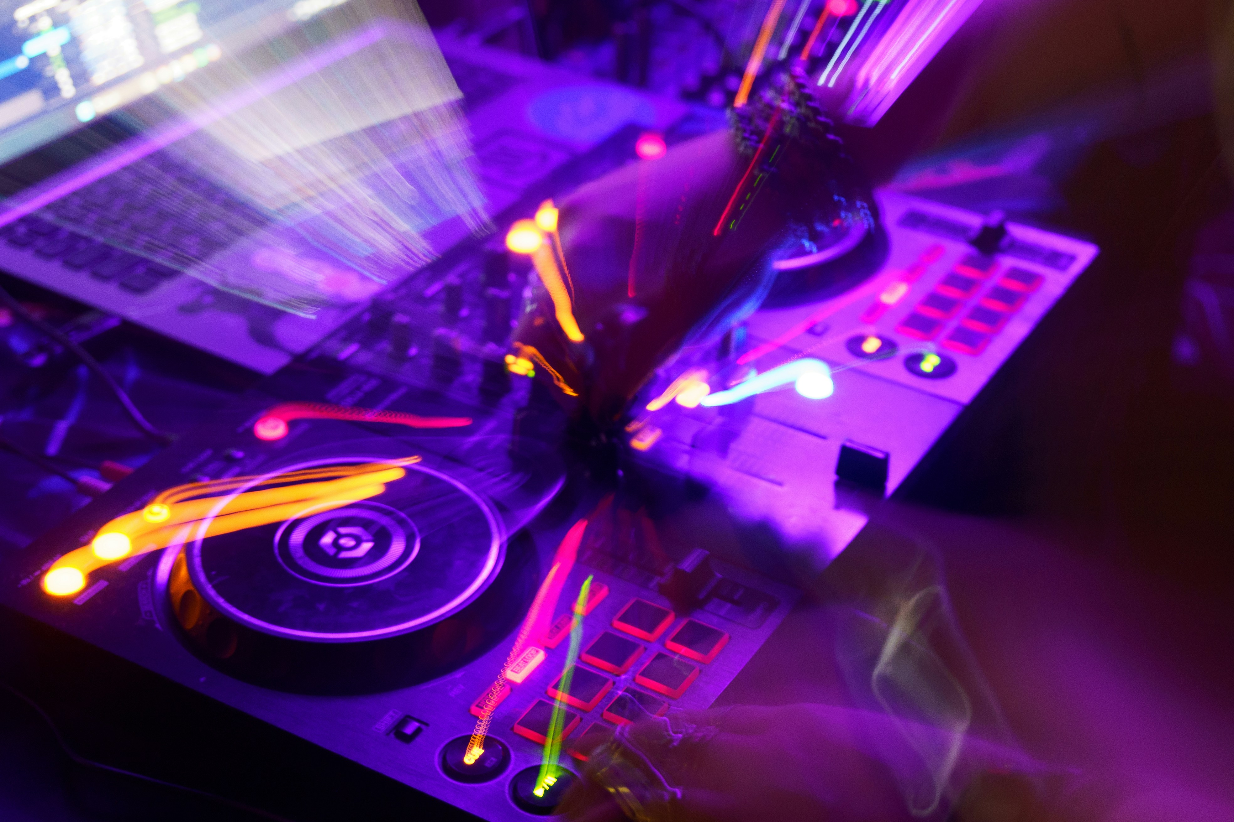Neon Pulse at the Deck: Nightclub DJ Mixer in Motion