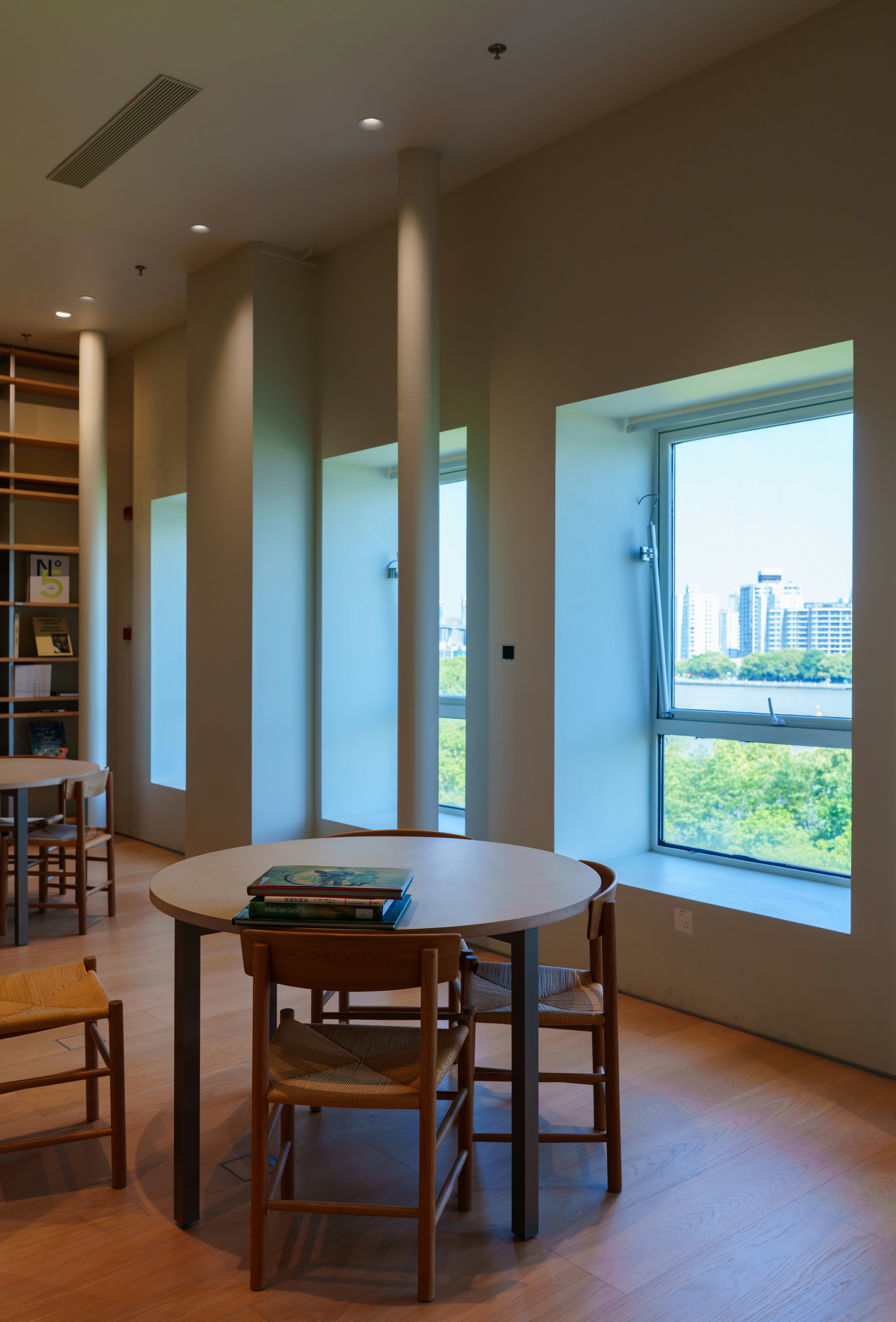 Sunlit Reading Nook Between Windowed Pillars