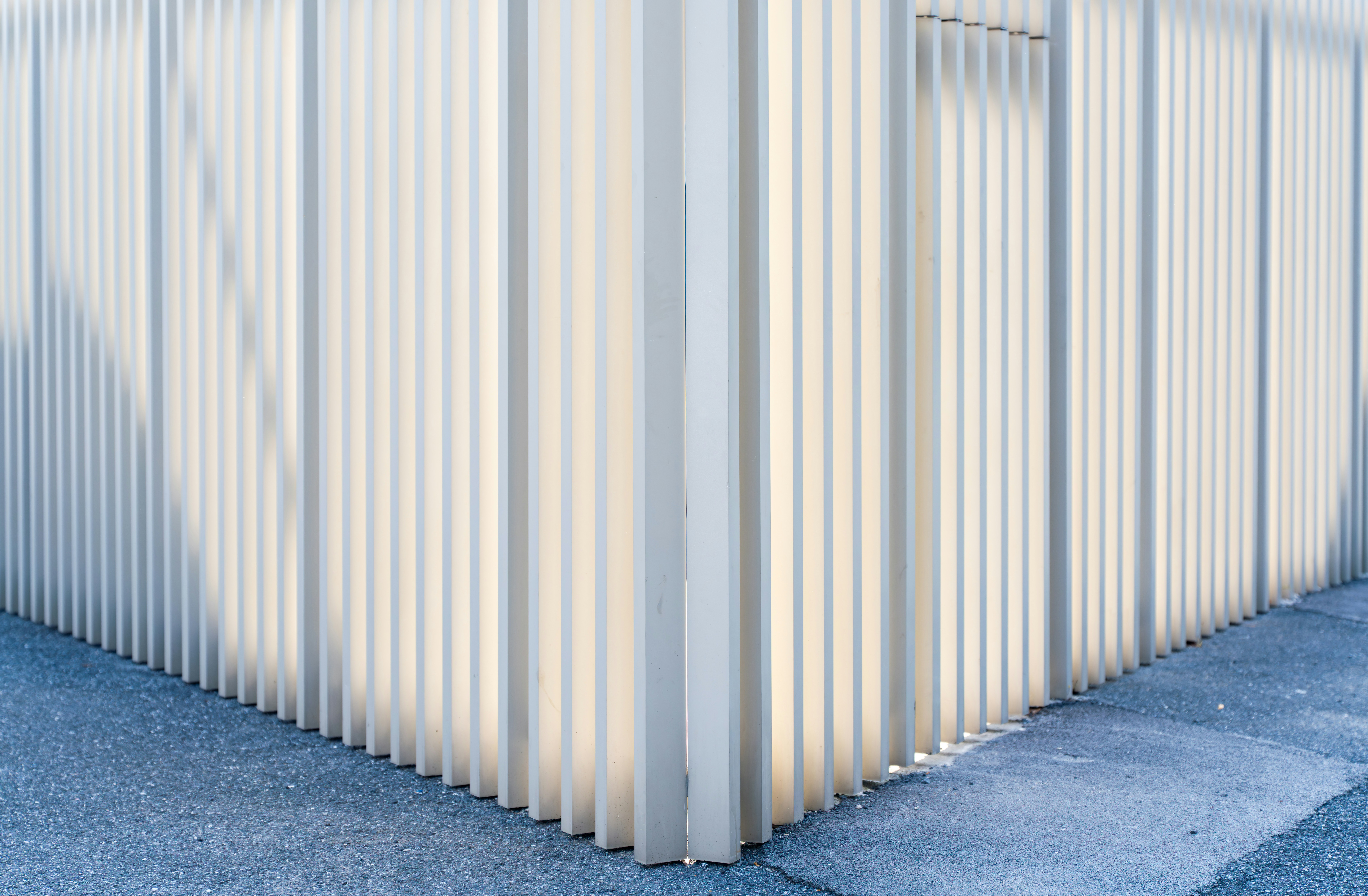 Vertical Rails, Subtle Shadows: Geometry of a Cornered Fence