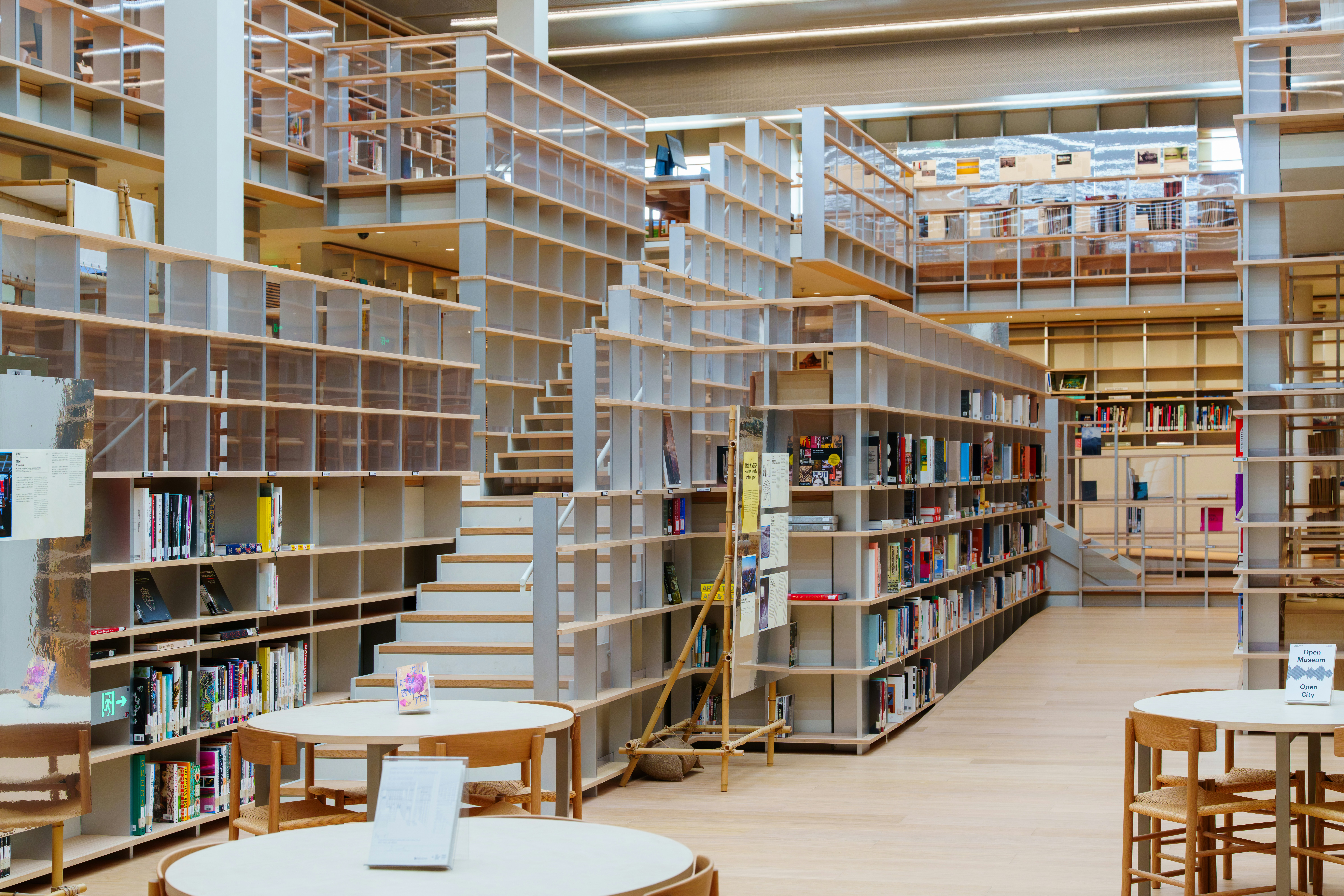 A Sunlit Library Labyrinth of Shelves and Tables