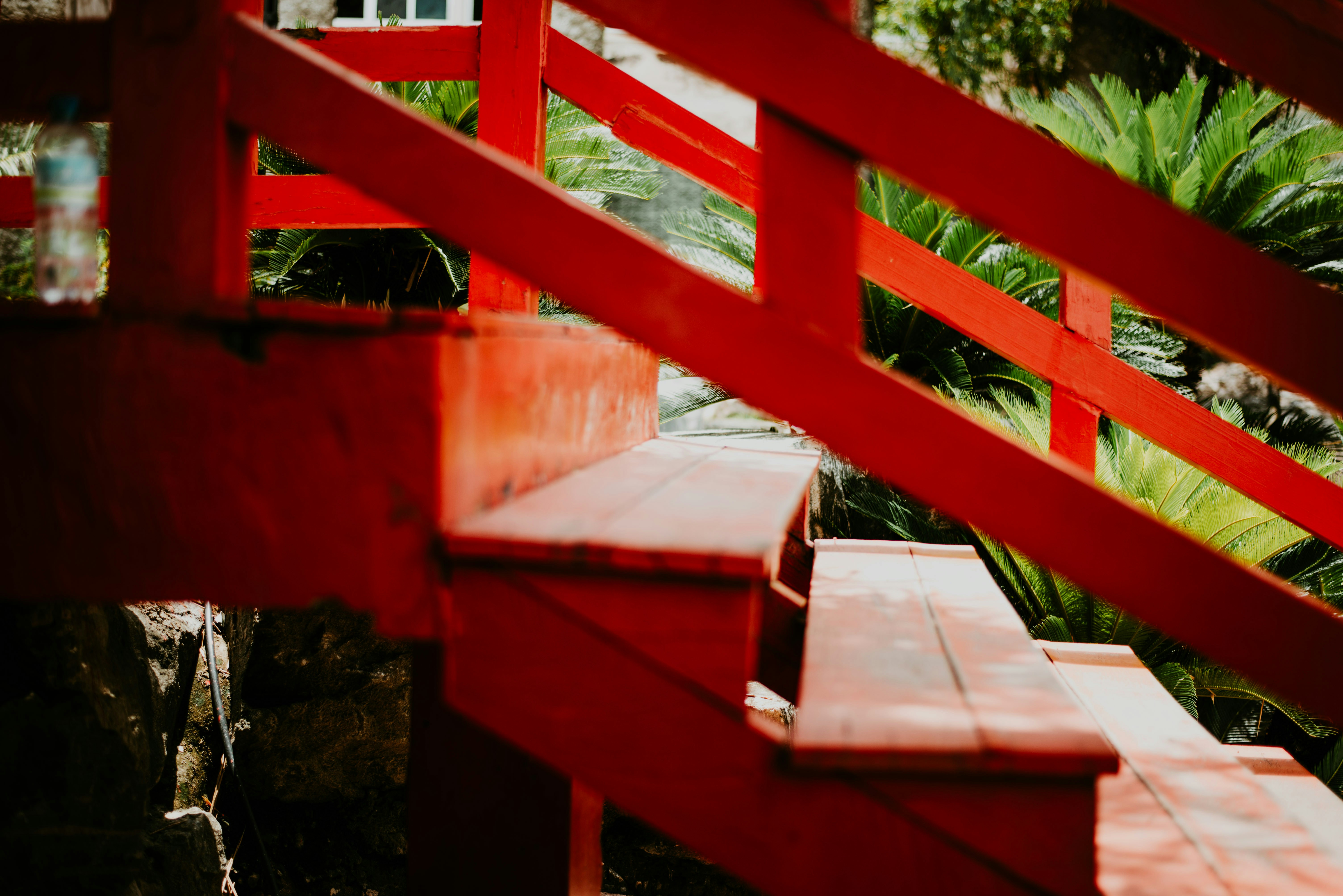 Scarlet Steps: A Geometric Play of Shadows and Railings