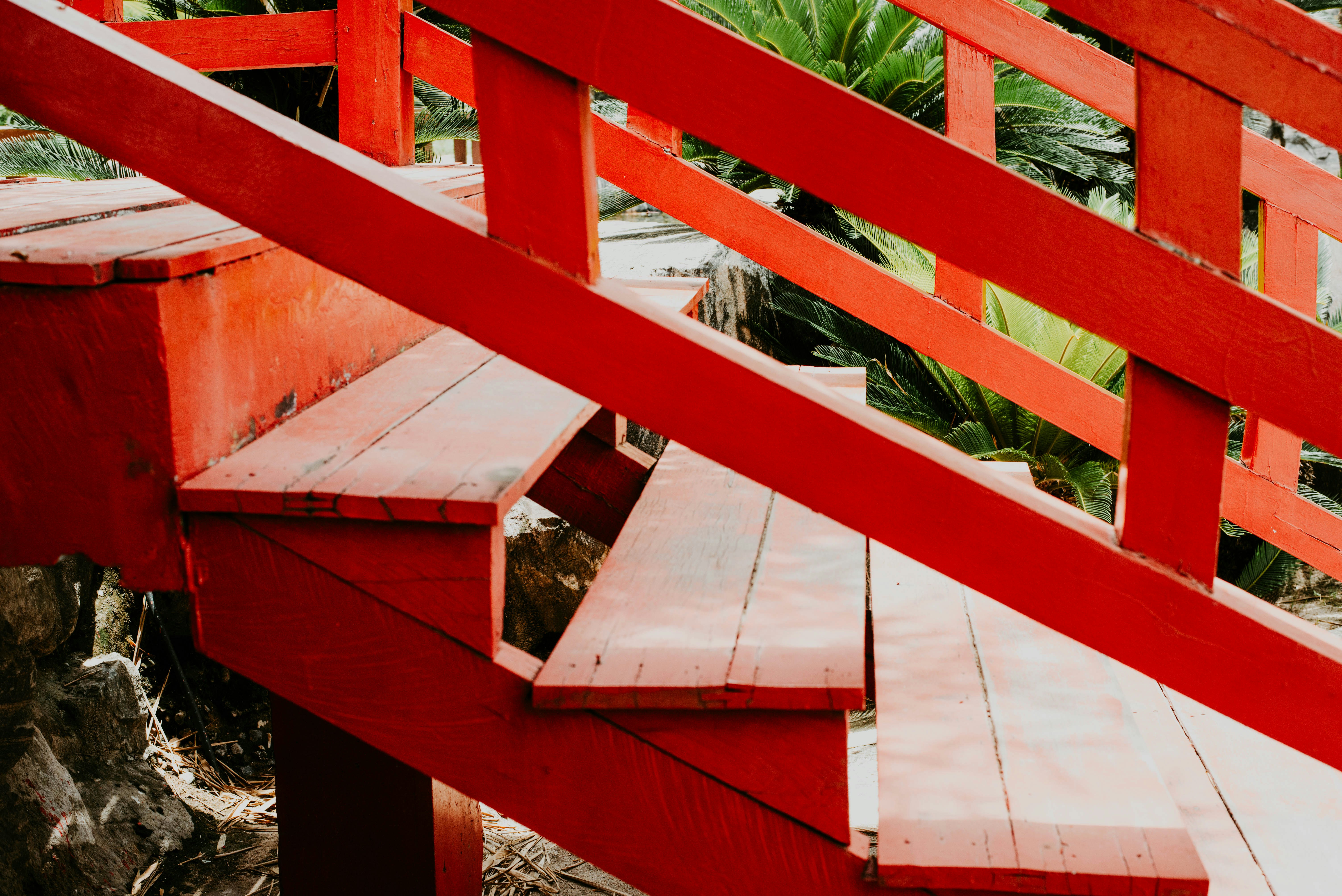 Crimson Steps: A Vivid Red Staircase Bends Through the Frame
