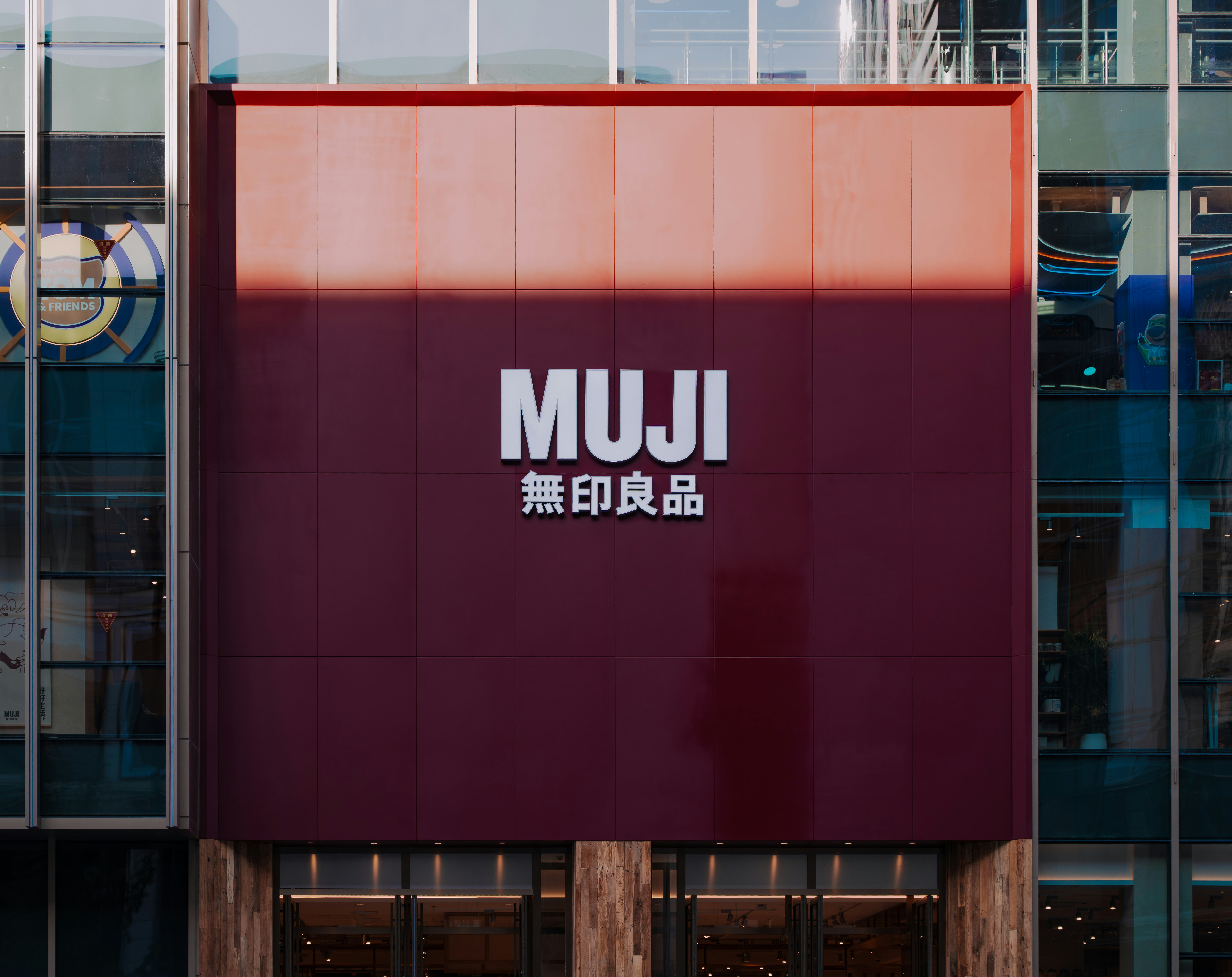 MUJI Facade in Soft Shadow: A Minimalist Urban Moment