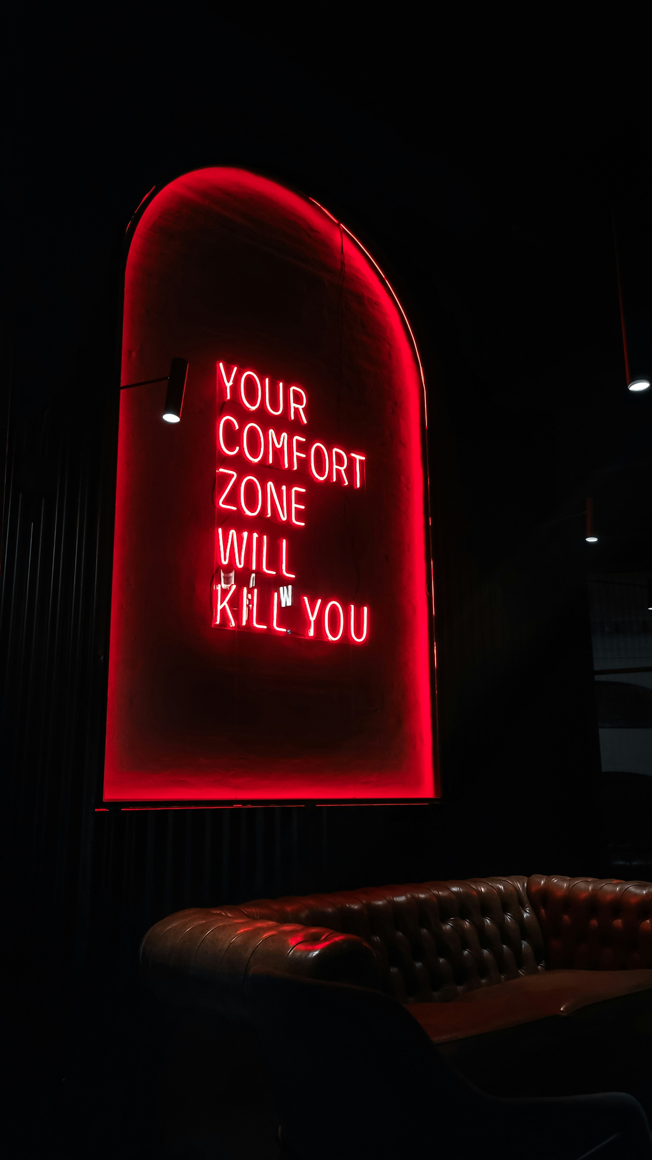 Neon Red Quiet: A Lounge Sign Glowing in the Darkness