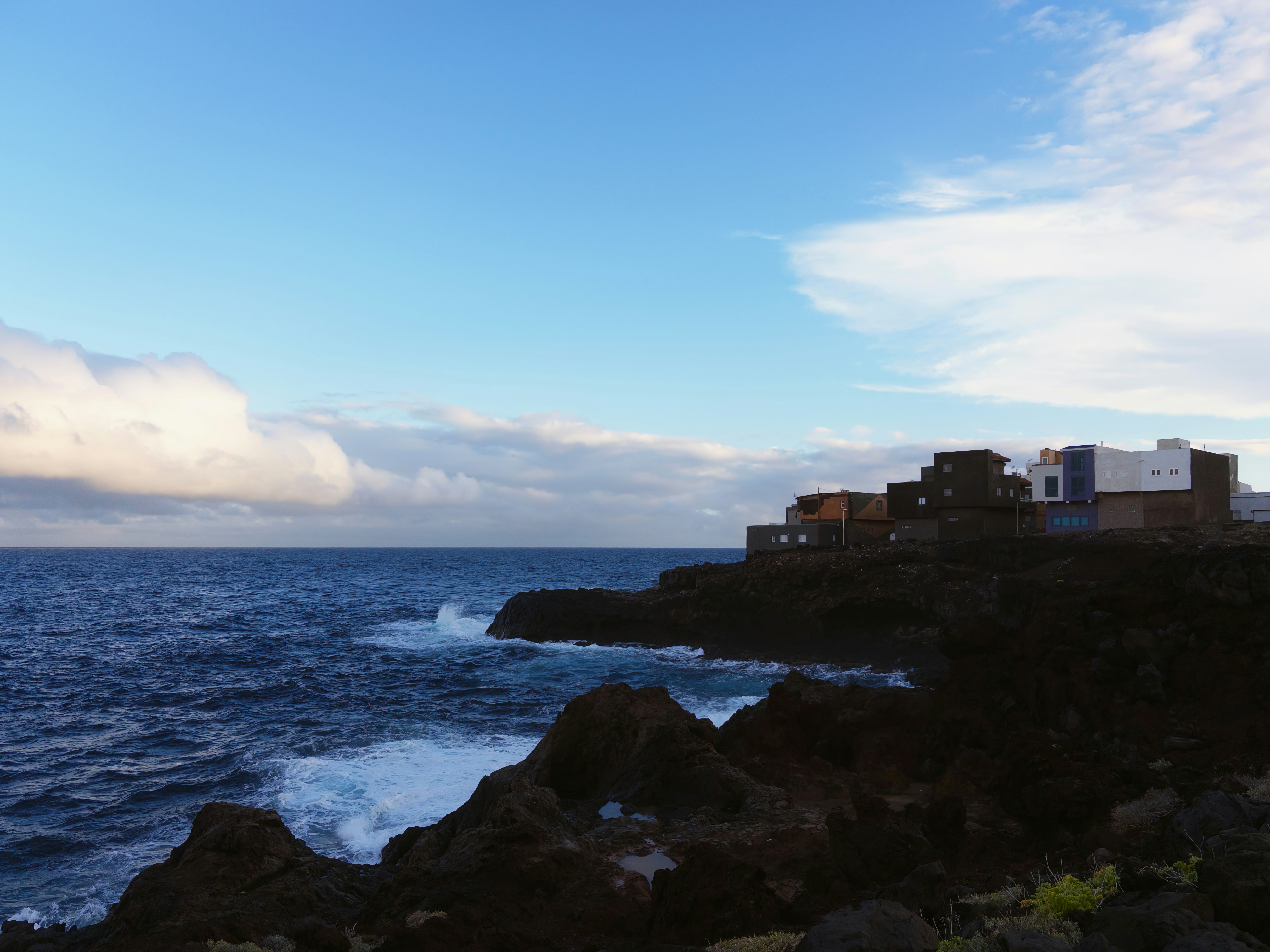 Clifftop Village Against Atlantic Horizon