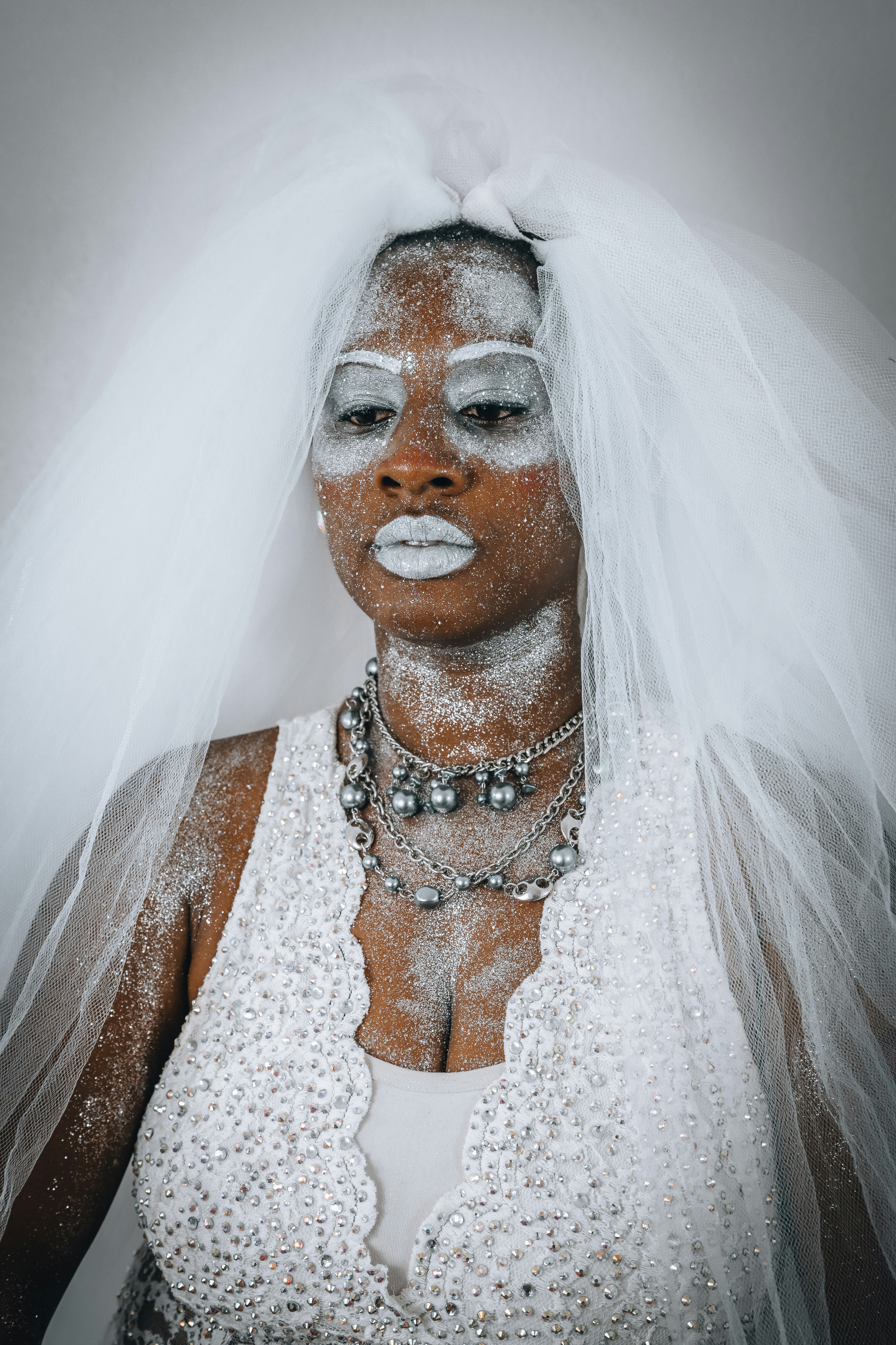 Veiled Bride in Pearled Snow: A Studio Portrait of Frost and Veil