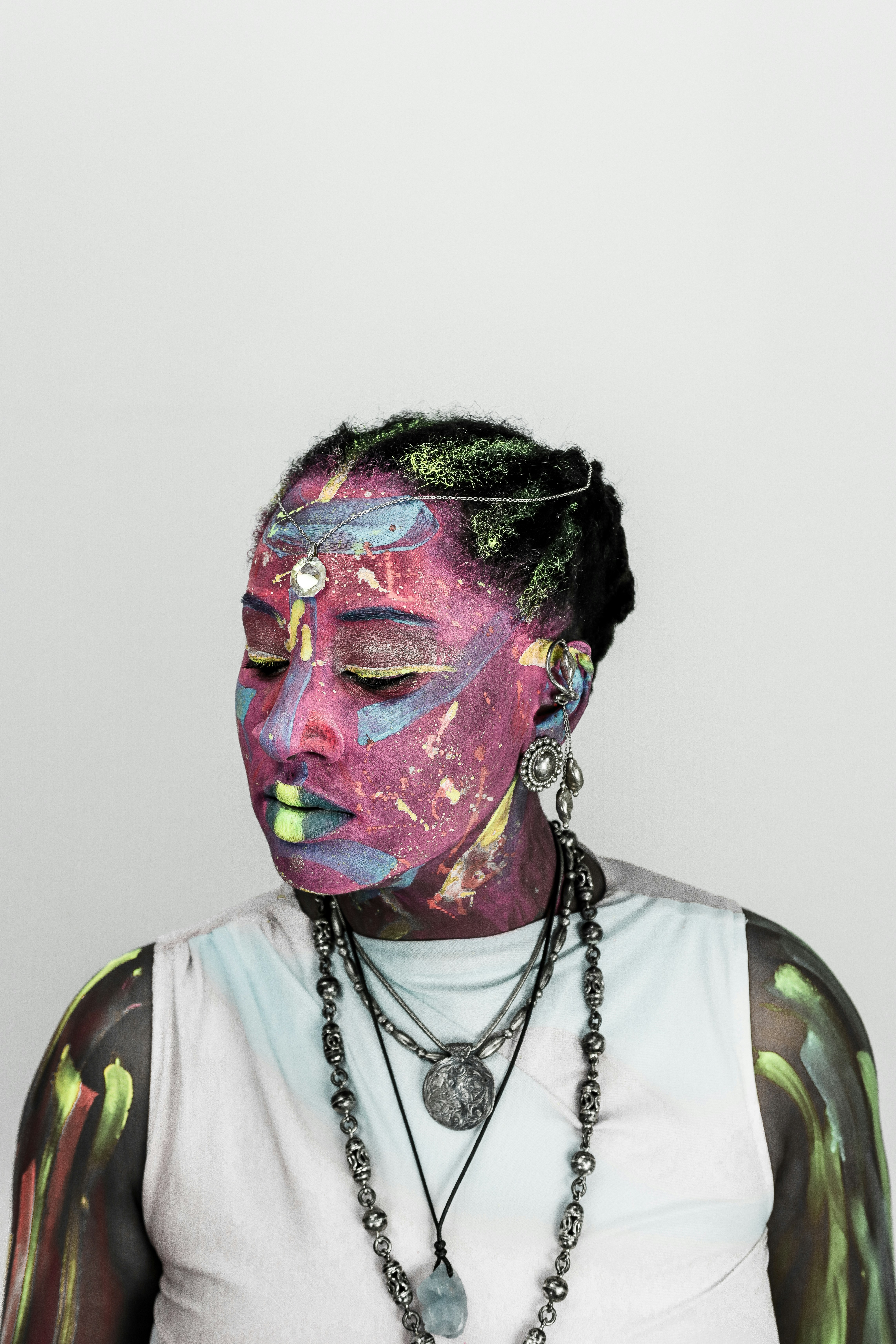 Neon Warrior: Face Painted in Cosmic Colors