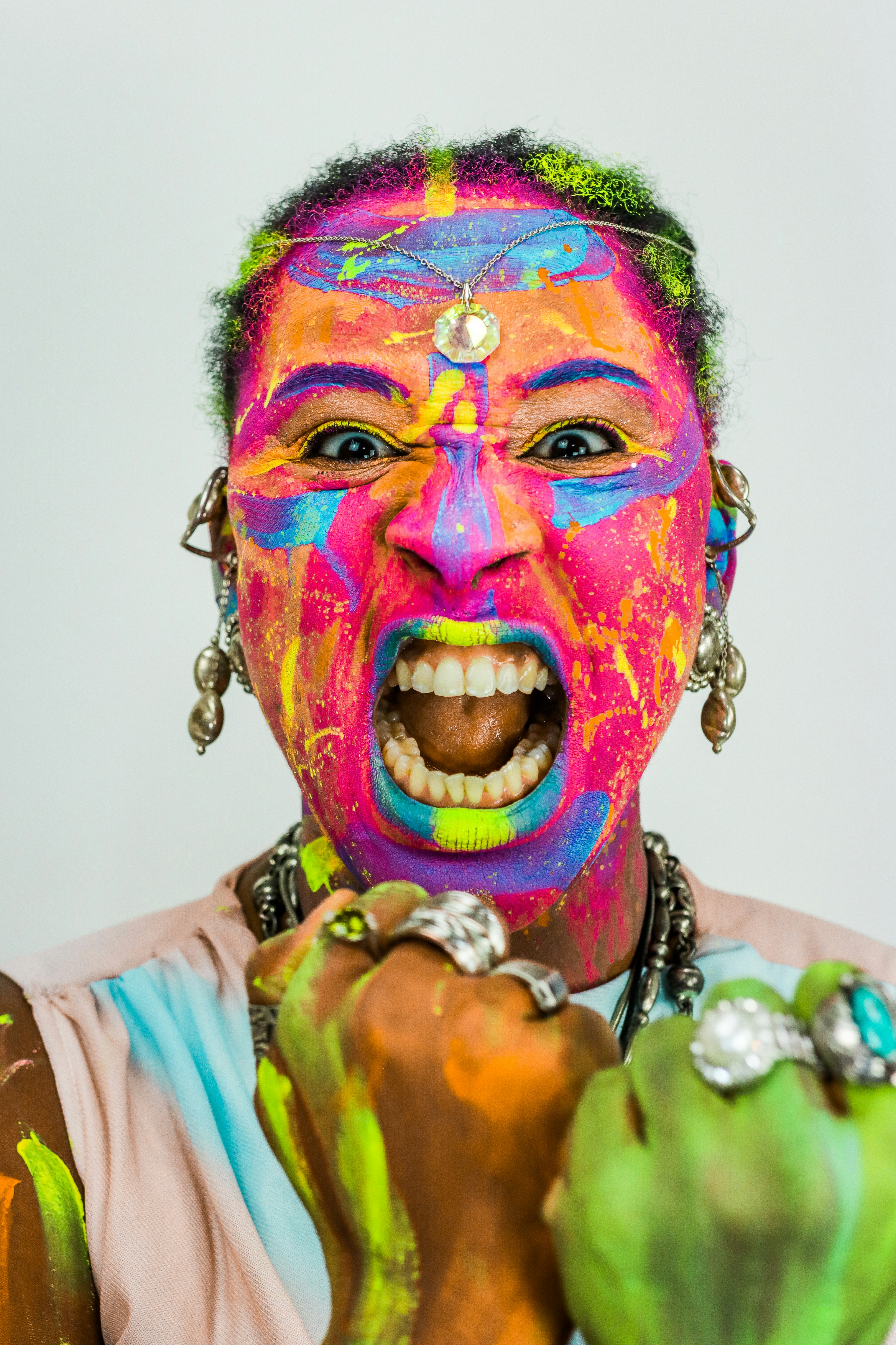Neon Face of Fury: A Carnival of Paint and Expression