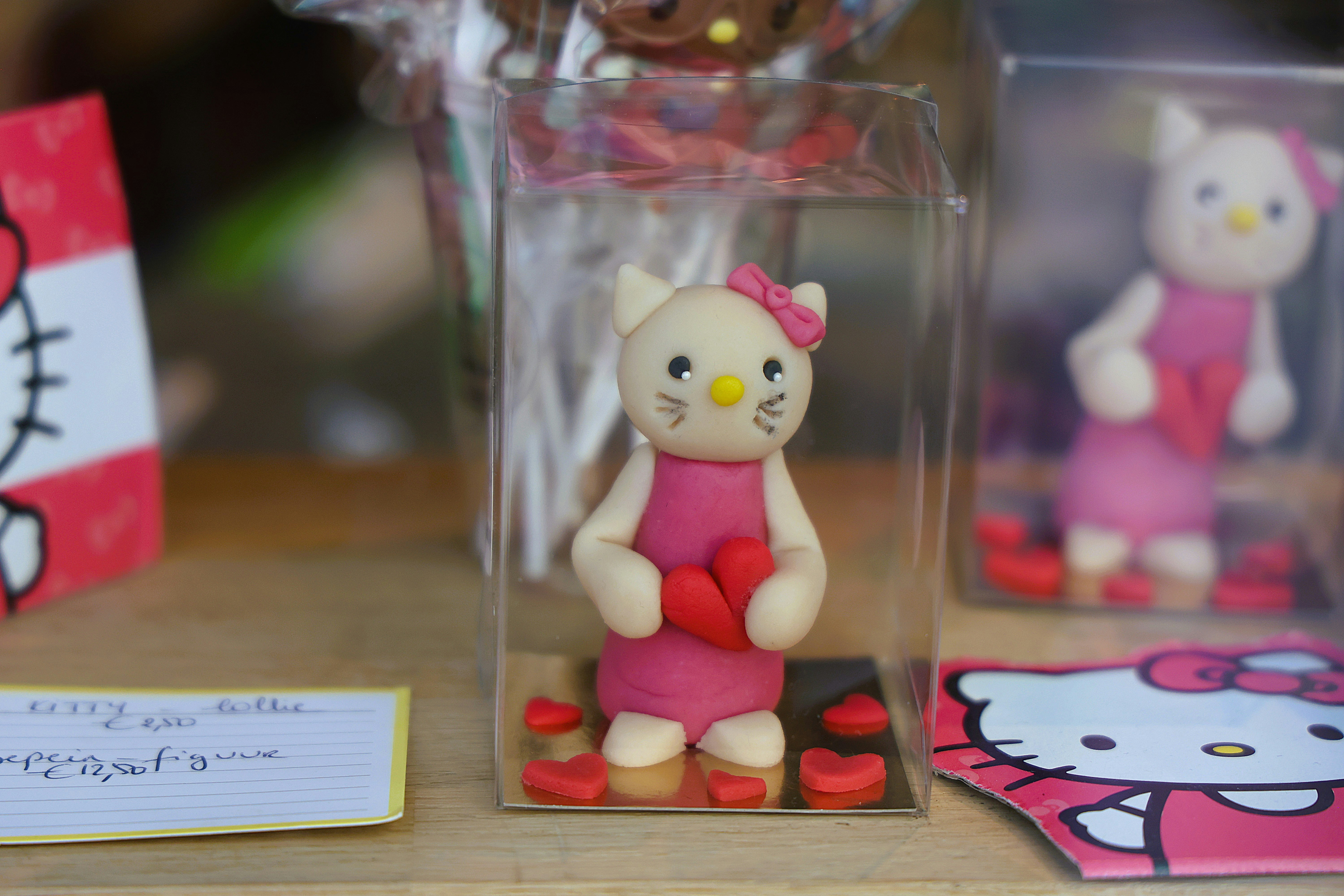 Heart-Brimmed Kitty in a Tiny Glass Case