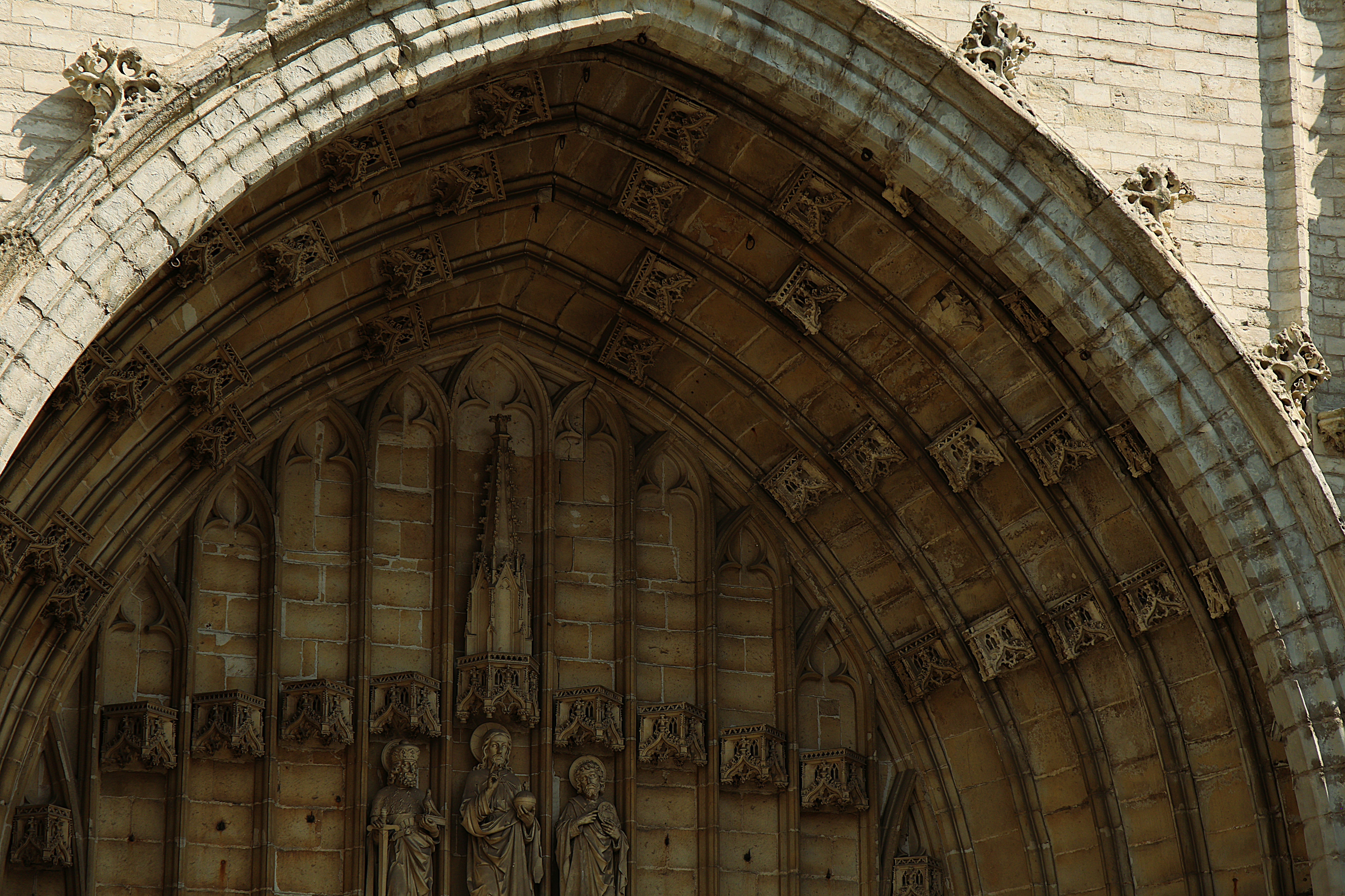 Stonework Odyssey: The Archway's Carved Chorus