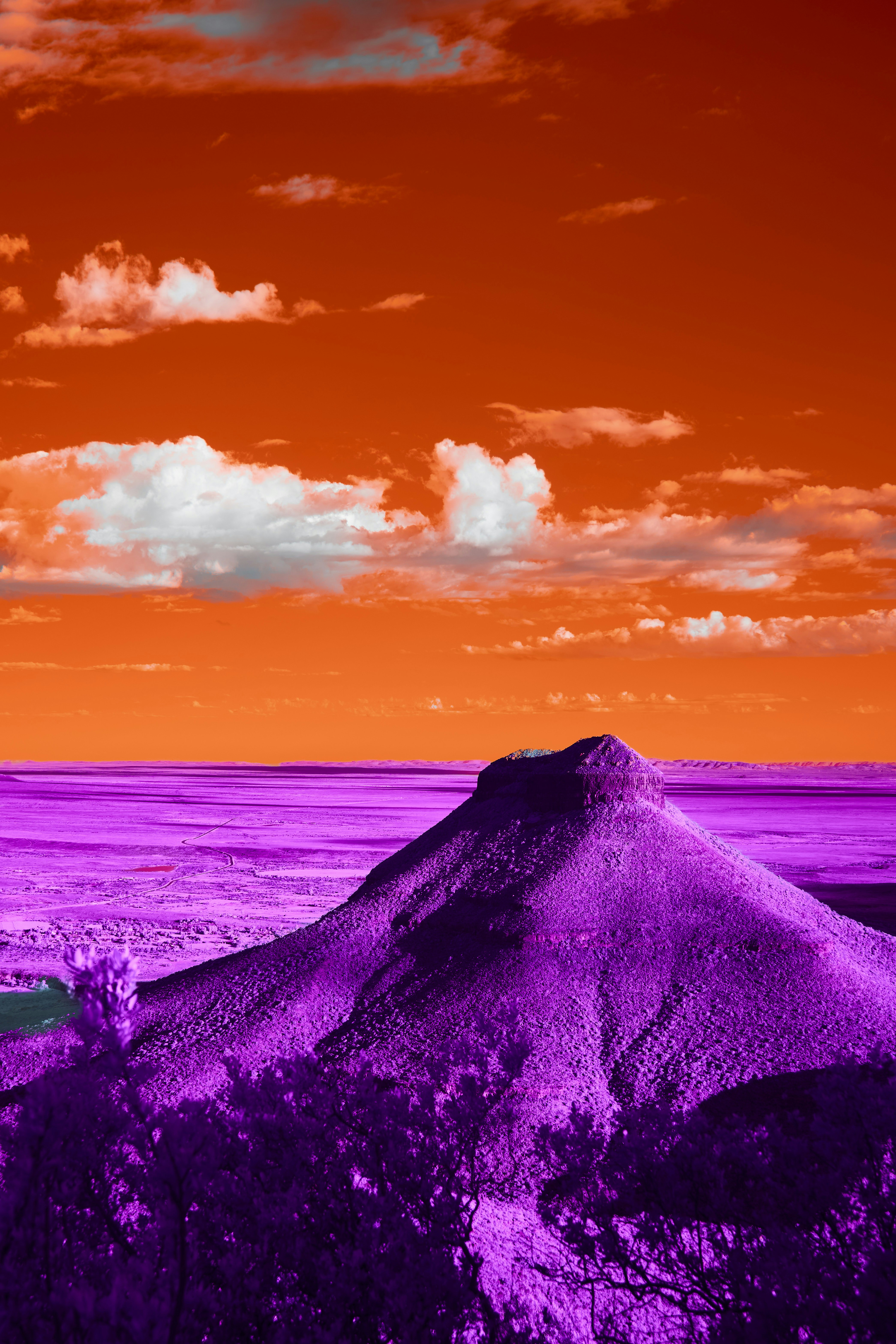 Crimson Sky Over a Violet Volcano