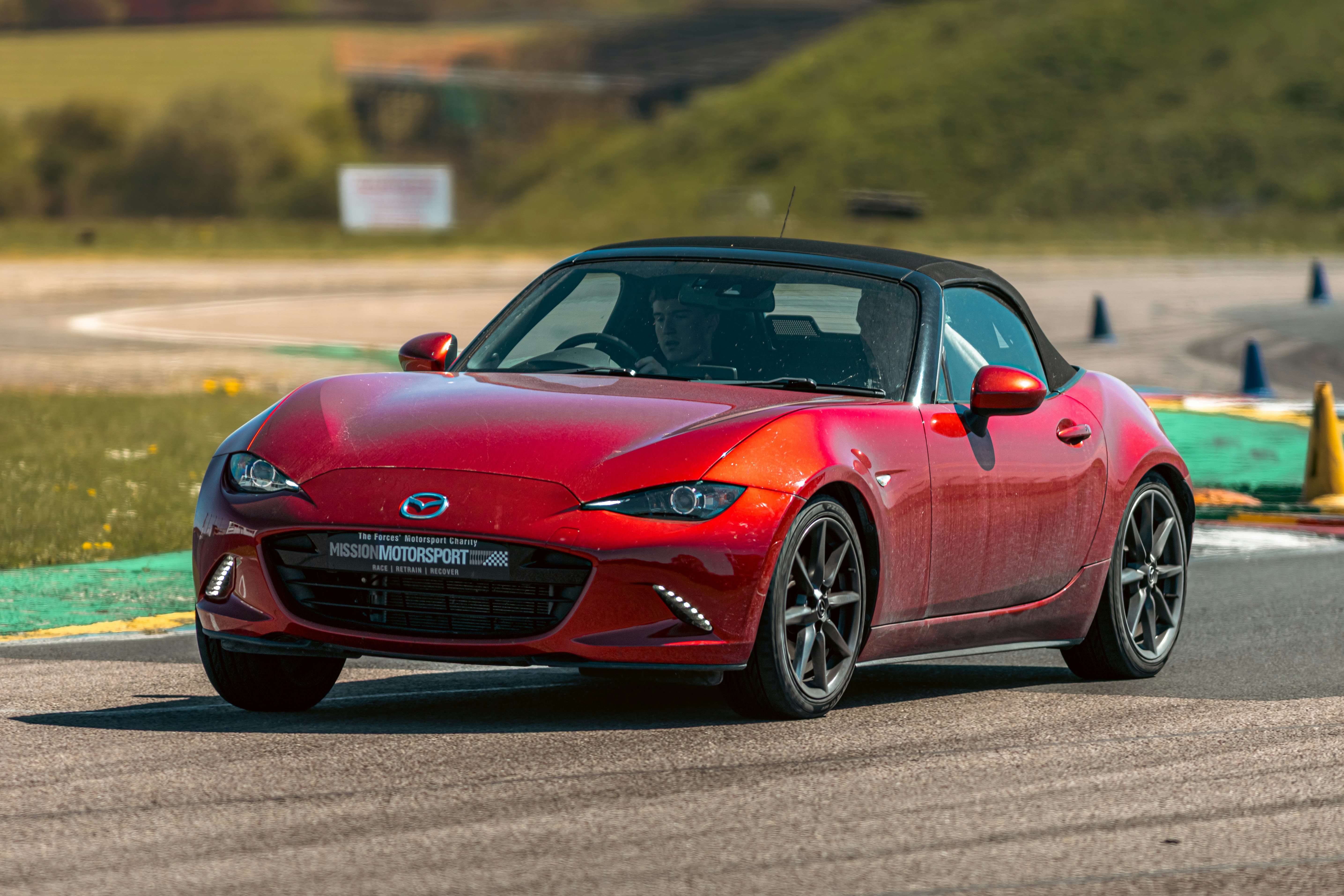 Red Mazda MX-5 on a Curved Track: Motion, Light, and Breathable Roar