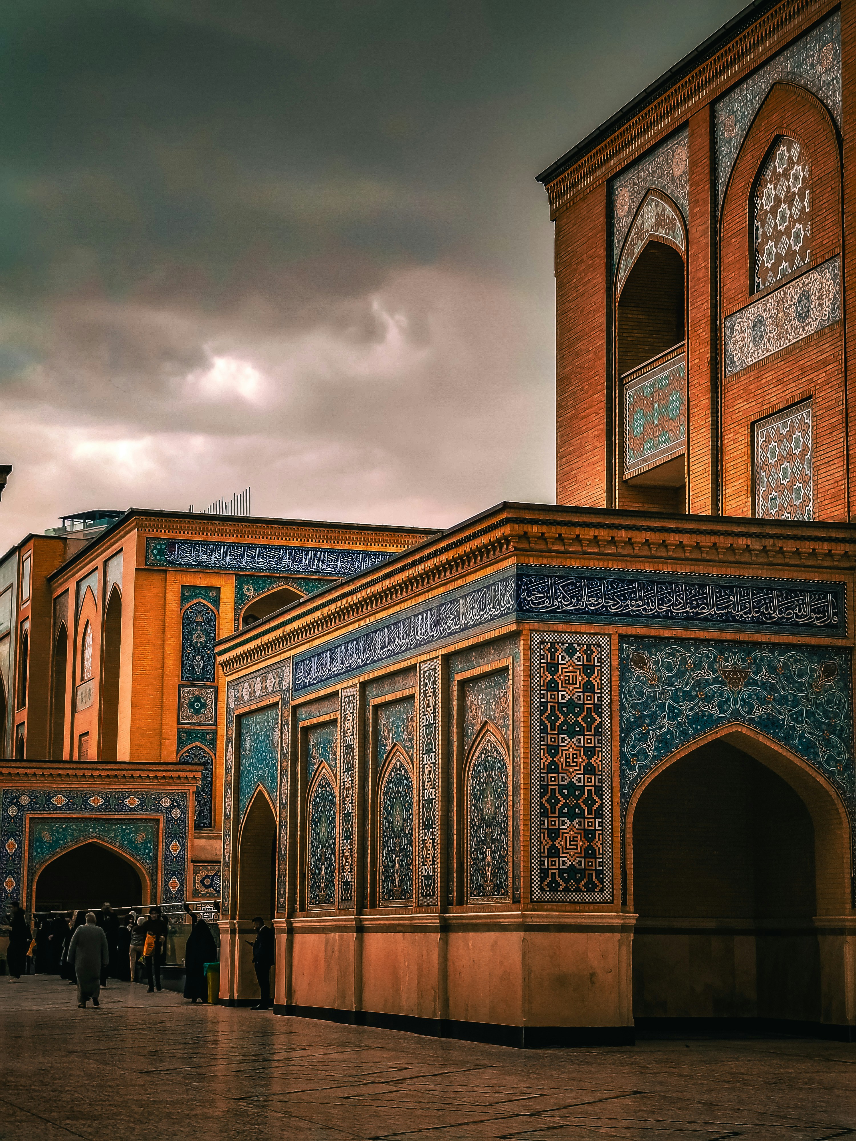 Tilework and Towers: A Mosque Courtyard Under Moody Skies