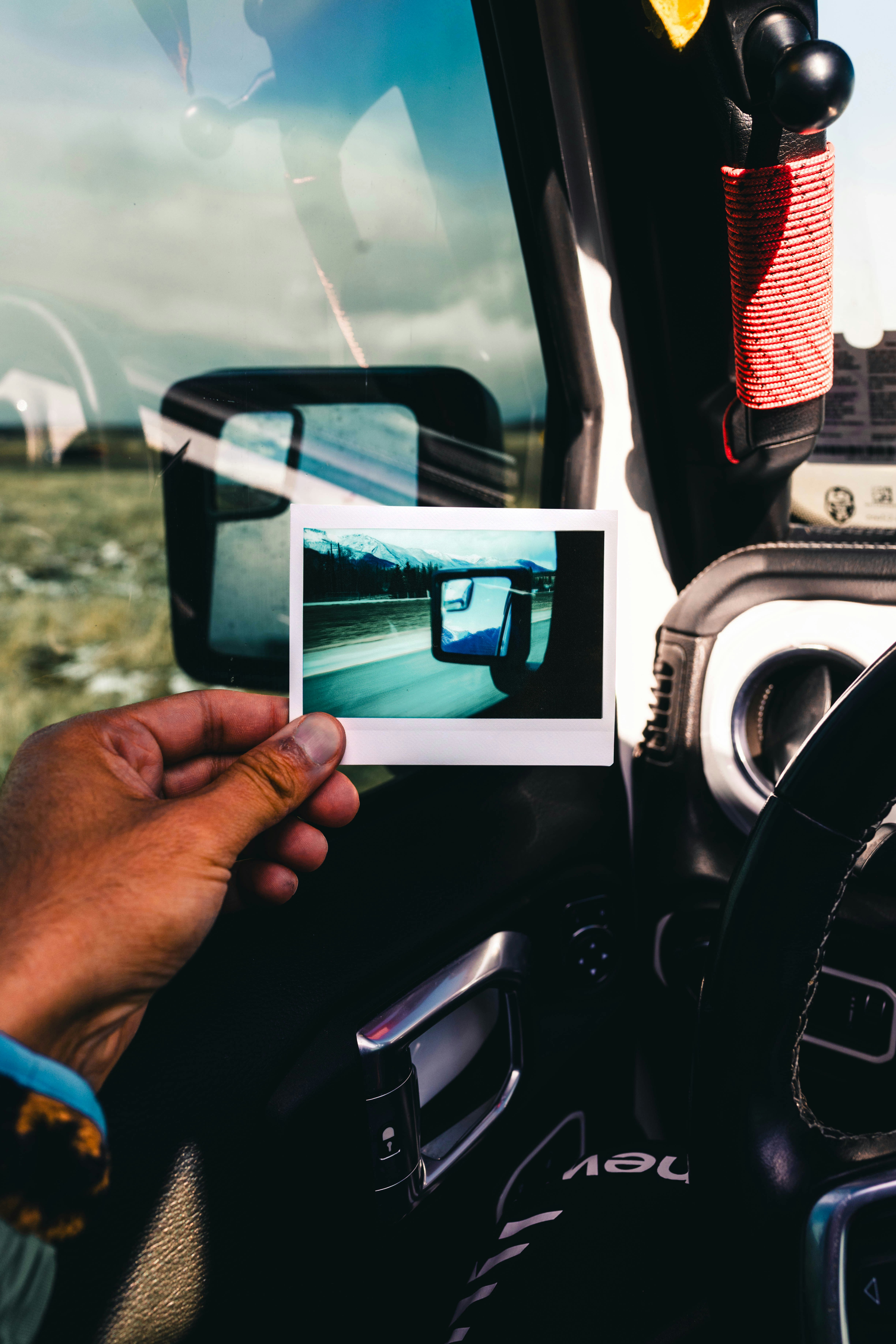 Polaroid Moment: A Handheld Memory in a Vehicle Cabin