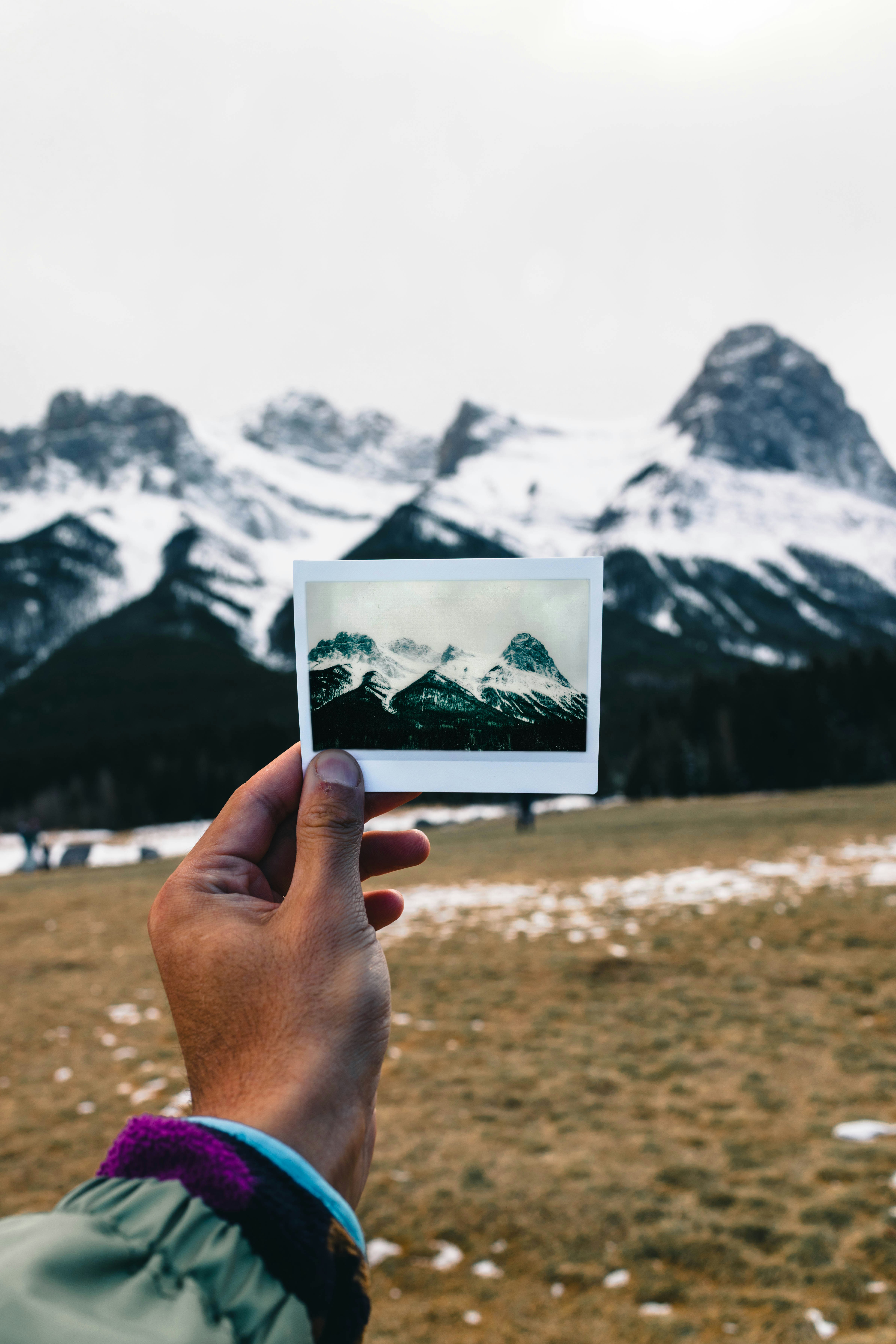 Polaroid in Focus: Mountain Echoes in a Handheld Moment