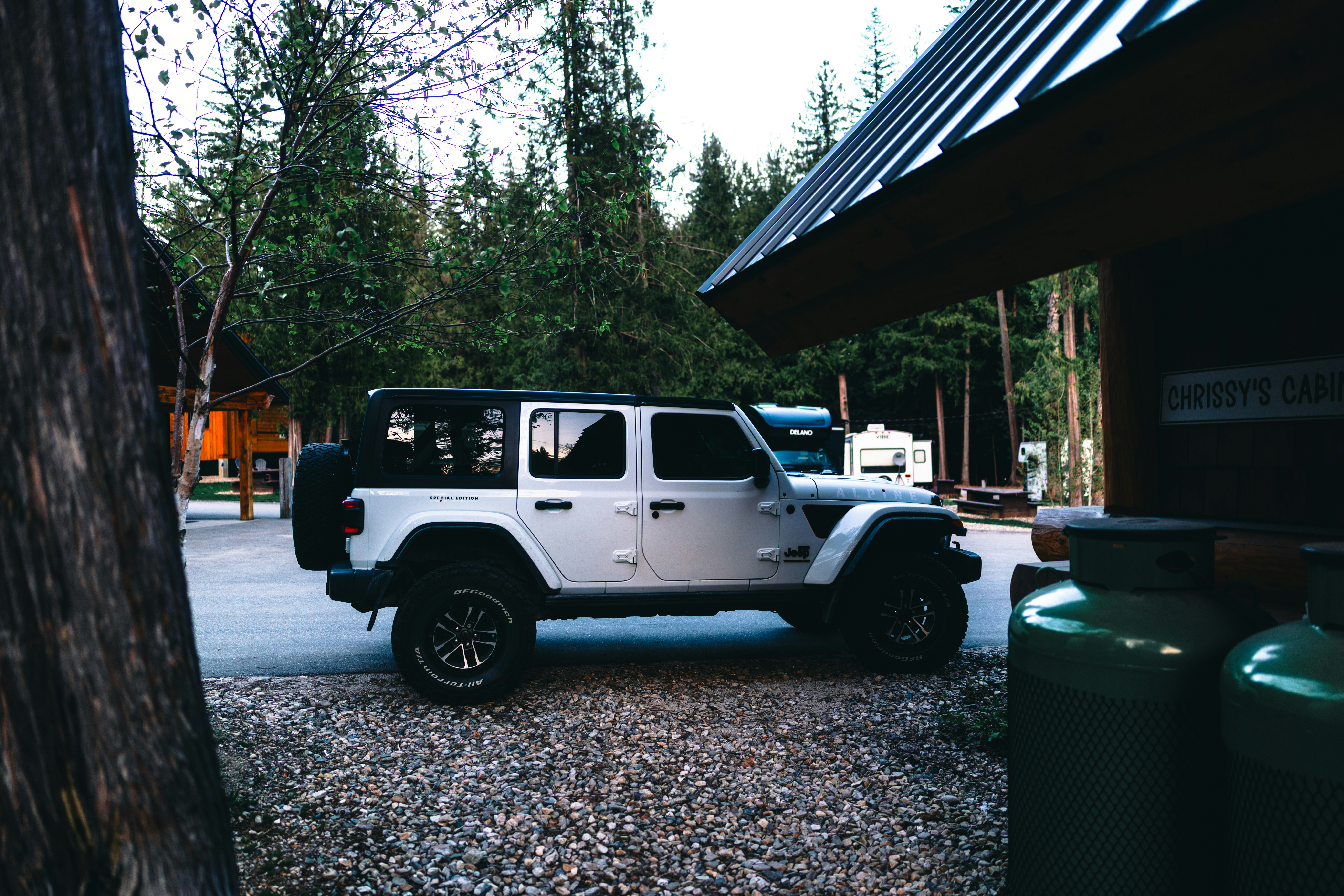 White Jeep at a Rustic Campsite