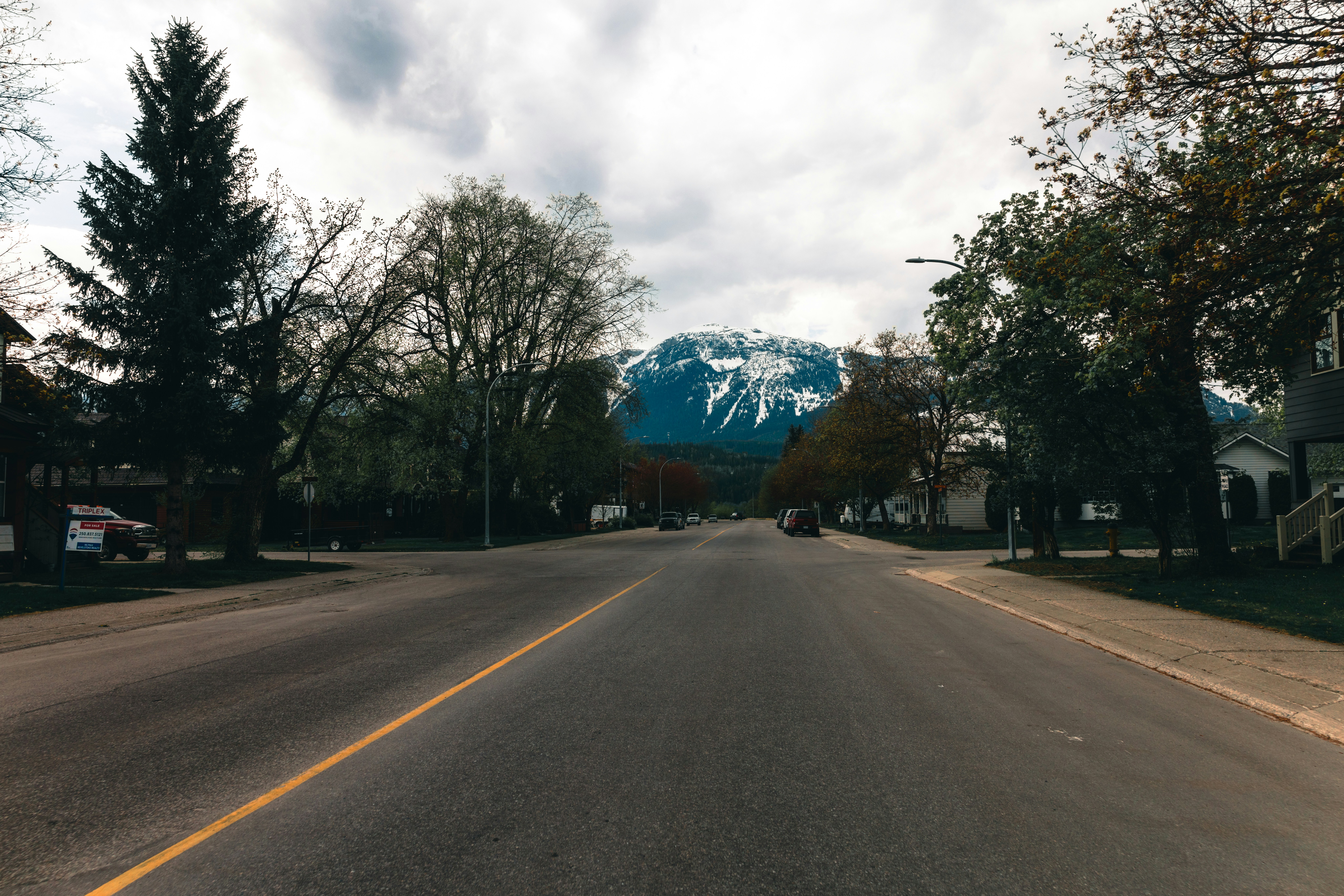 Street Toward Snow-Capped Summit