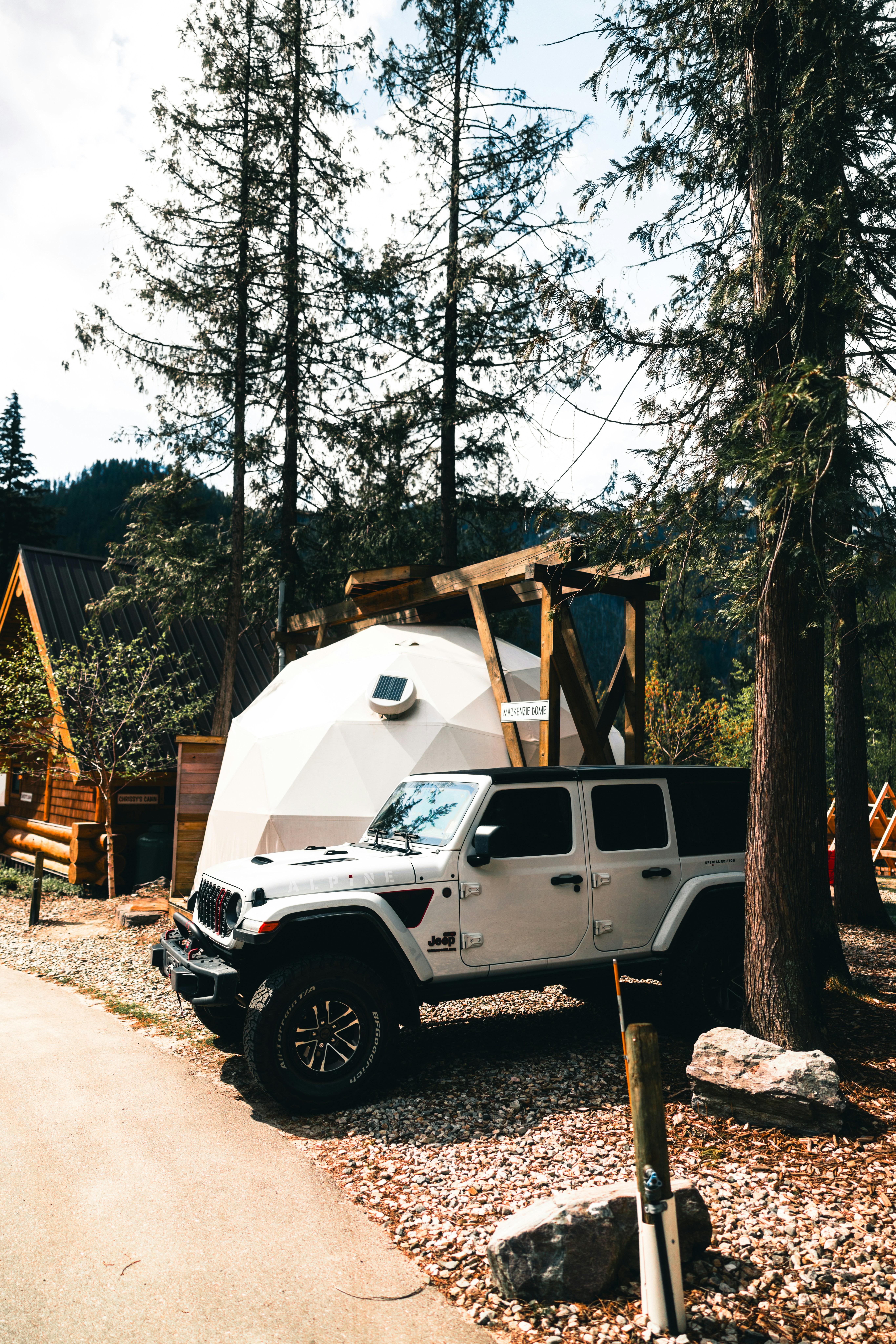 Geodesic Dome House and Jeep Rendezvous in a Pine Forest