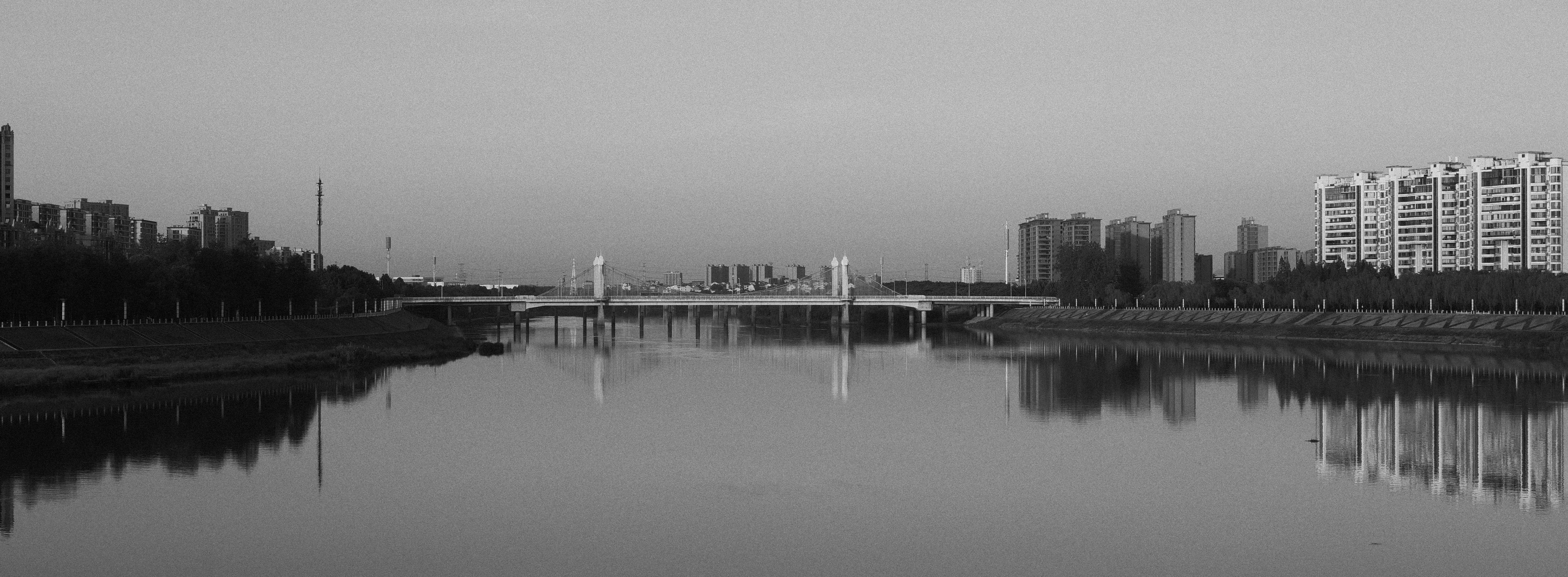 Silent Horizon: A Panoramic City Bridge at Dusk