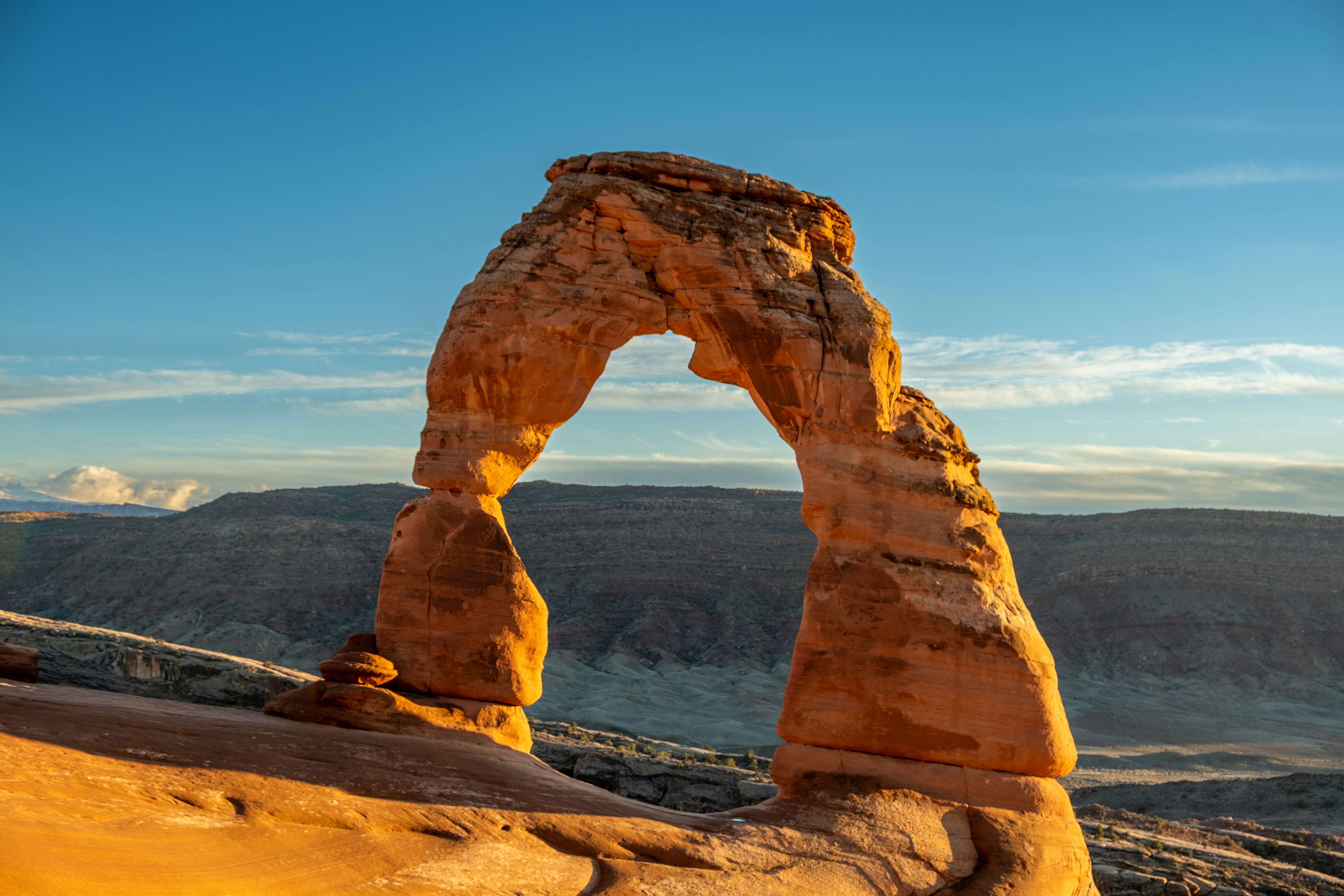 Stone Arch Framed by Desert Horizon at Golden Hour