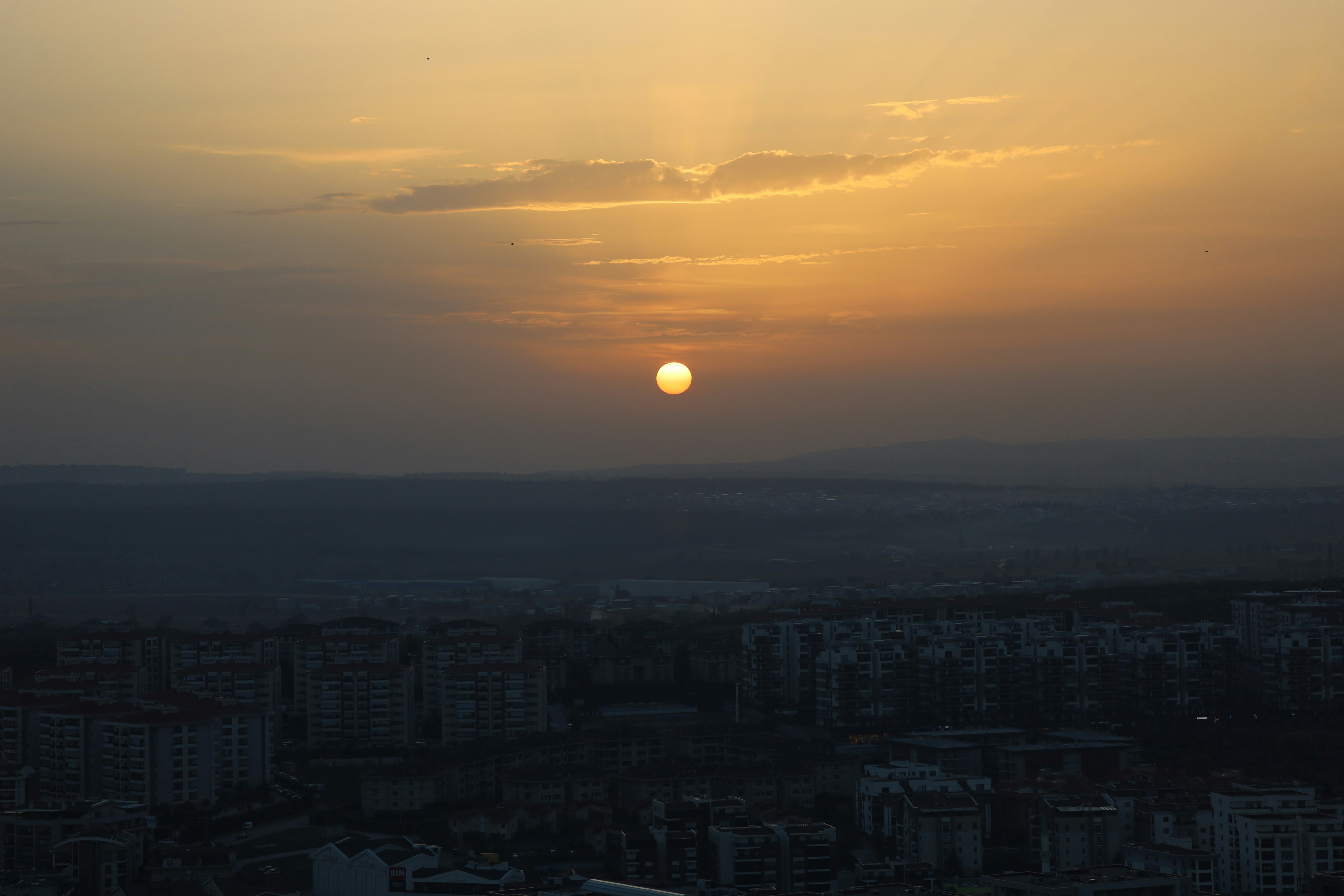 Horizon Glow Over a Quiet City at Dusk