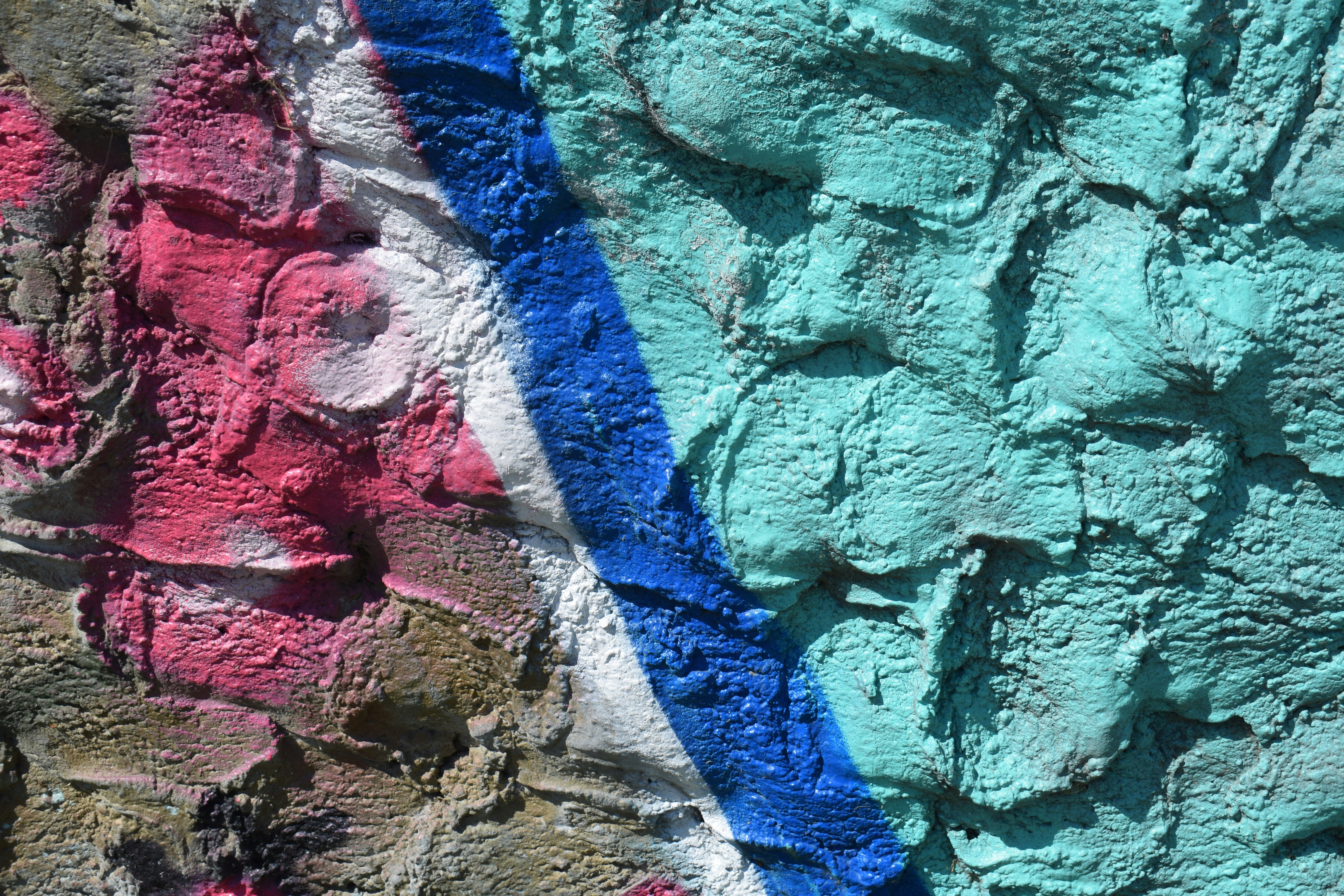 Cracked Color: A concrete mural unfurls bold pigment diagonals