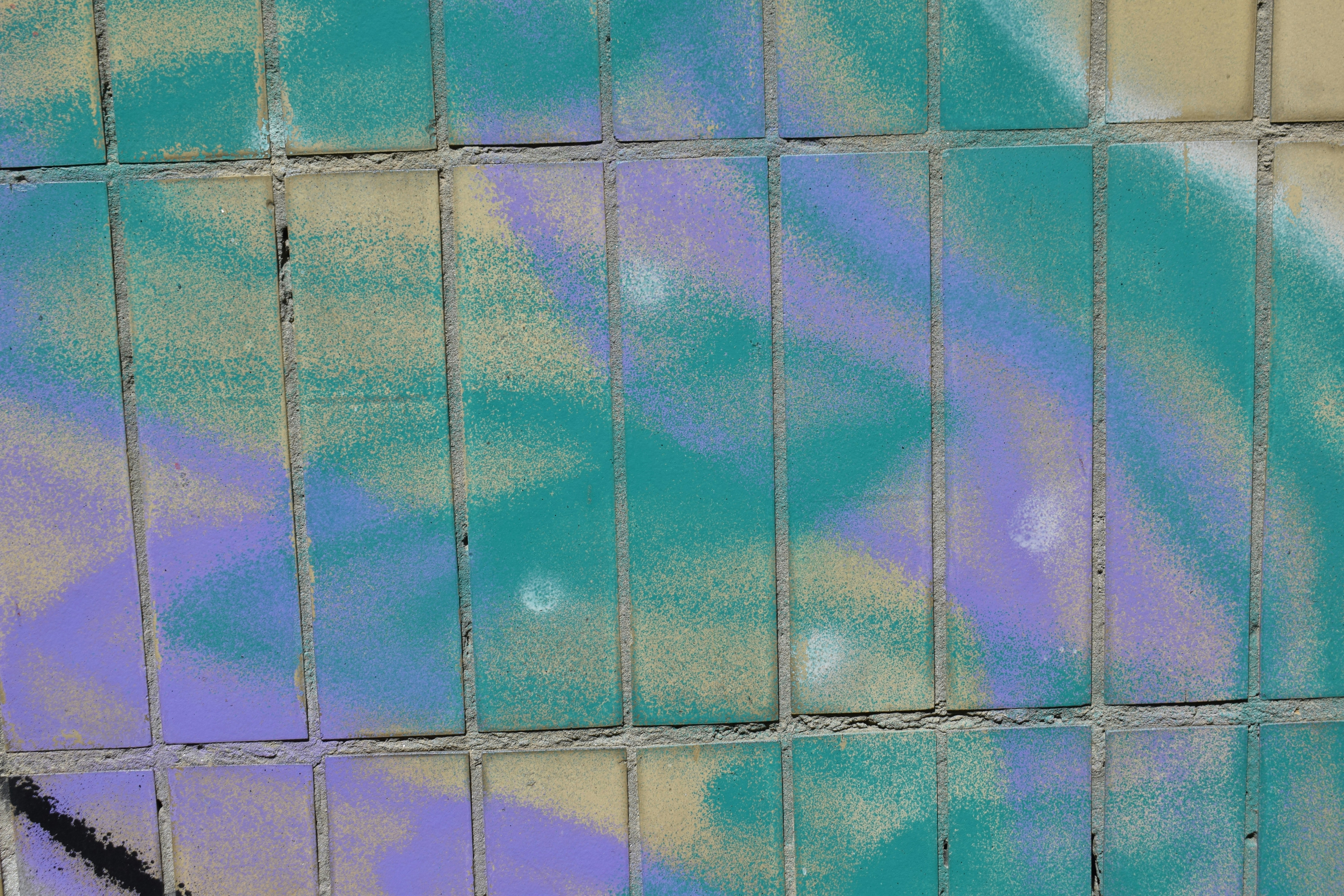 Pastel Graffiti Tiles: Soft Light Across a Patterned Wall