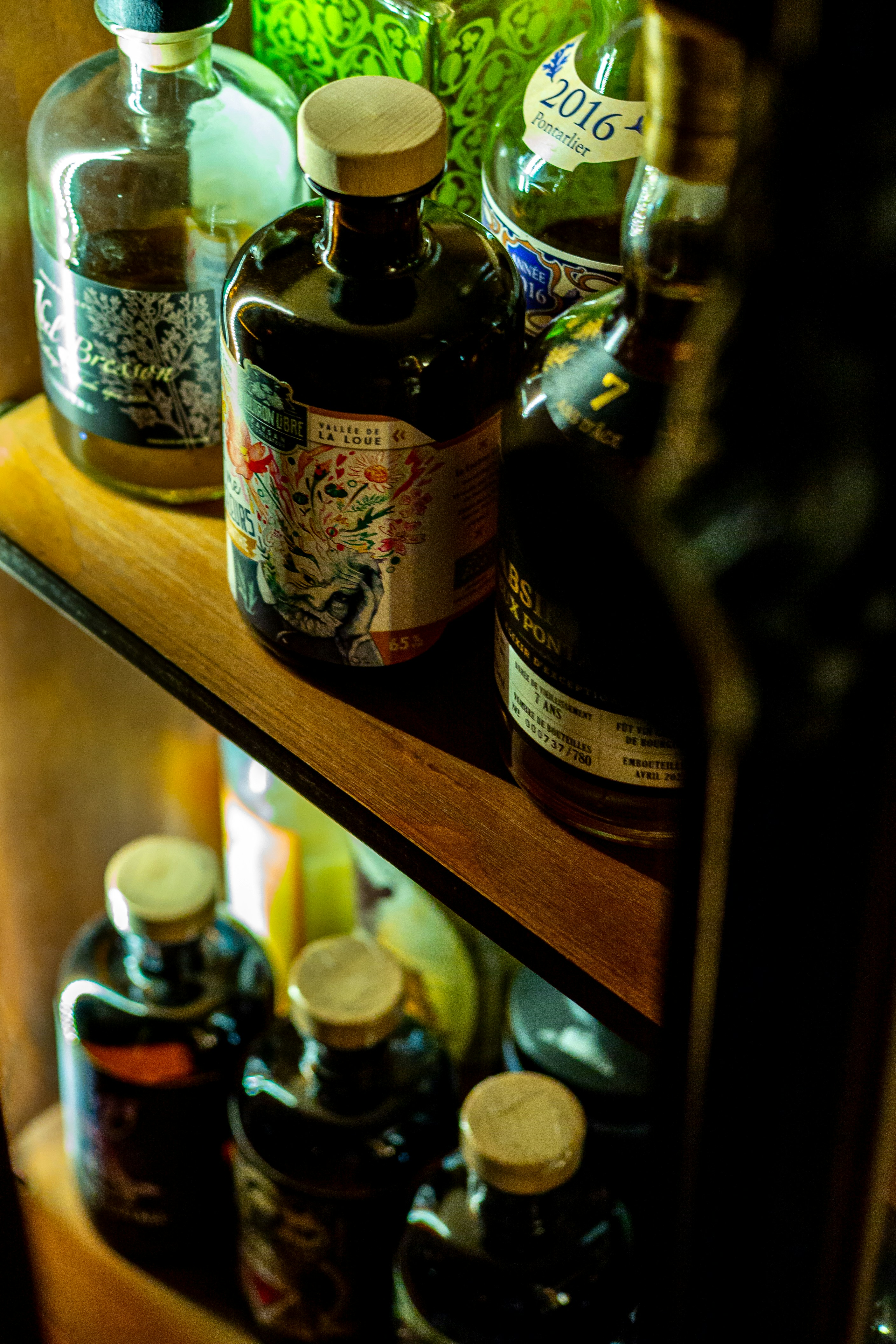 Glowing Bottles in a Dimly Lit Cabinet