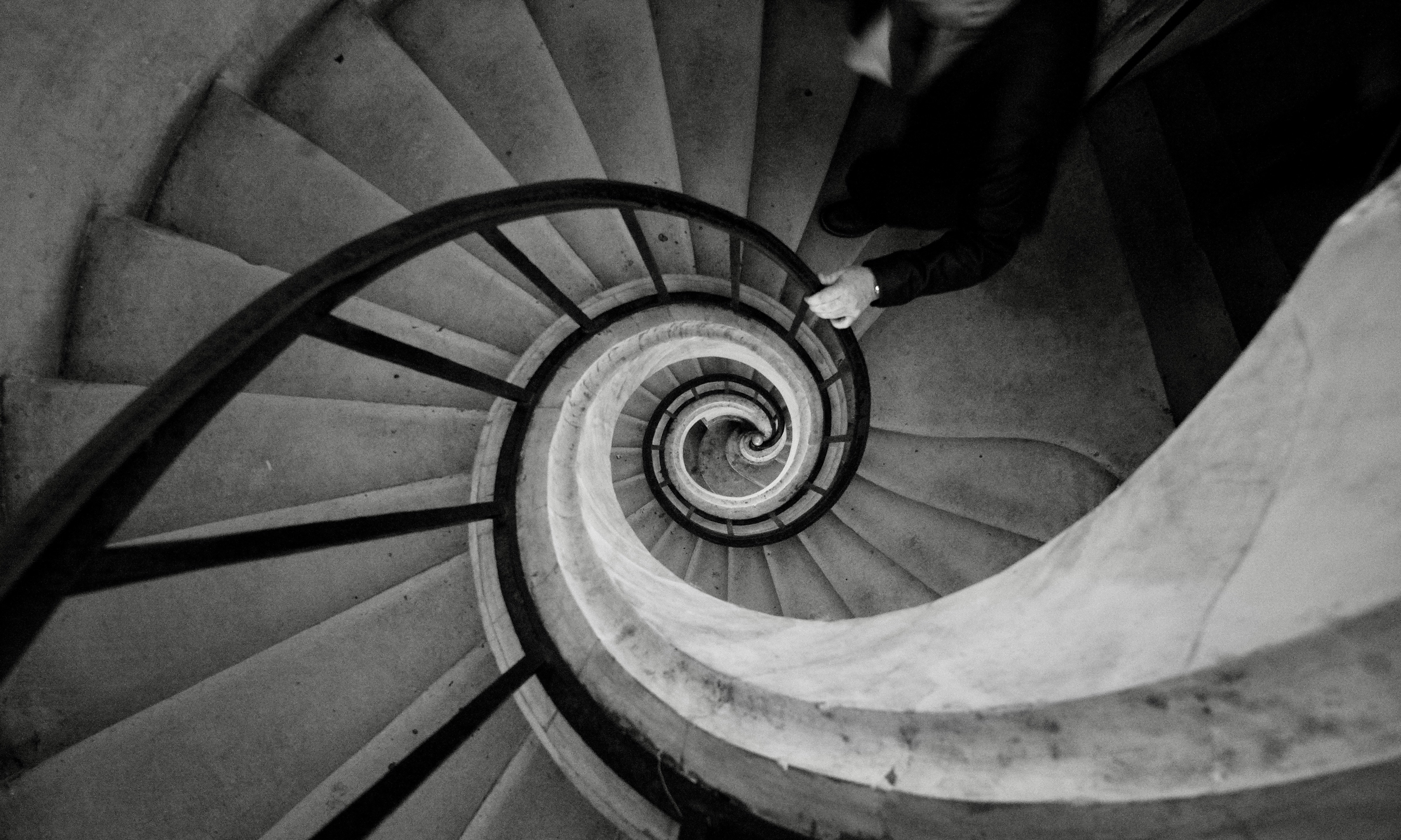 Spiral Descent: A Silent Hand on the Steps