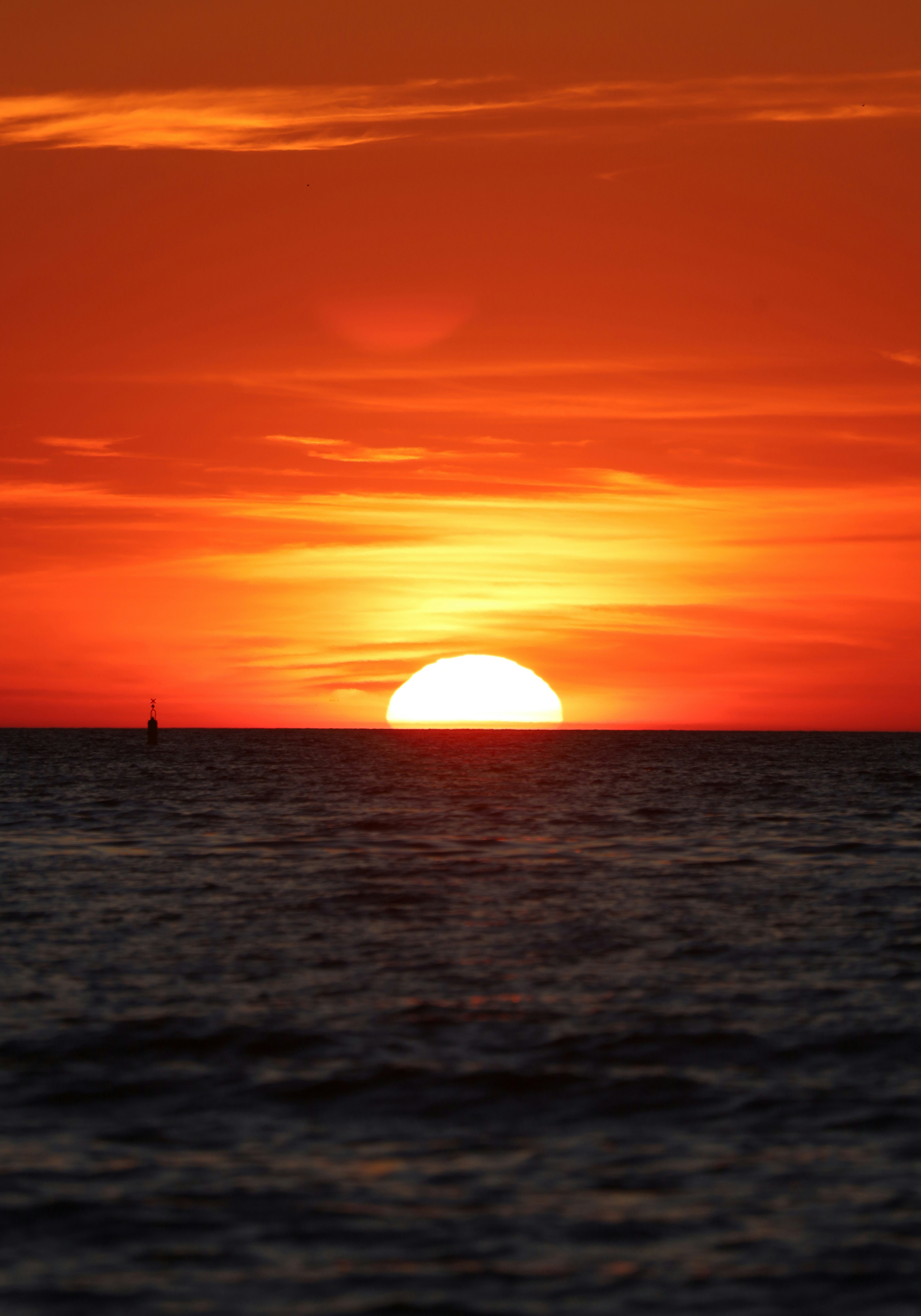 Sun-Drenched Horizon: The Last Light on a Calm Sea