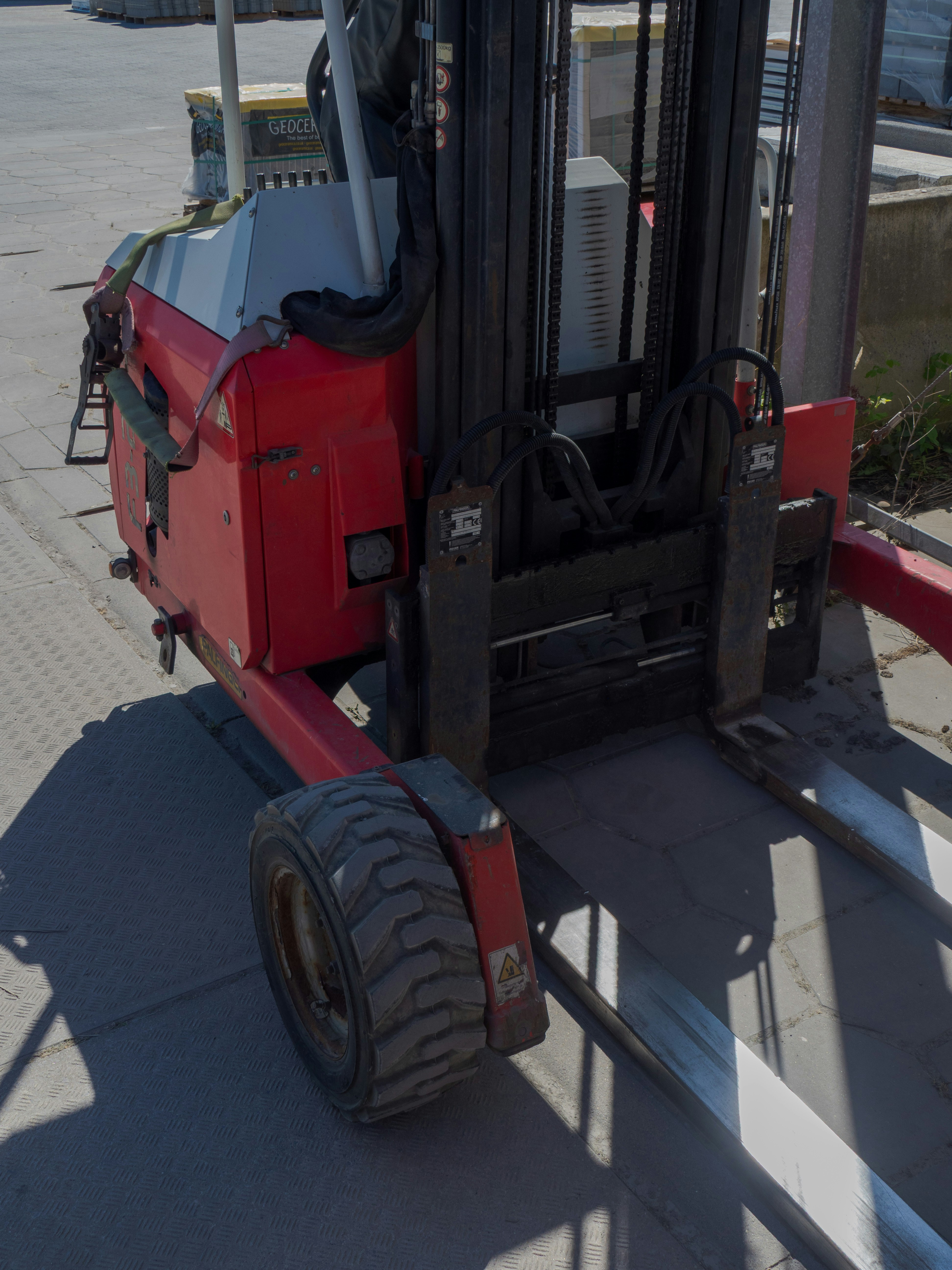Red forklift at the loading dock ready for operation