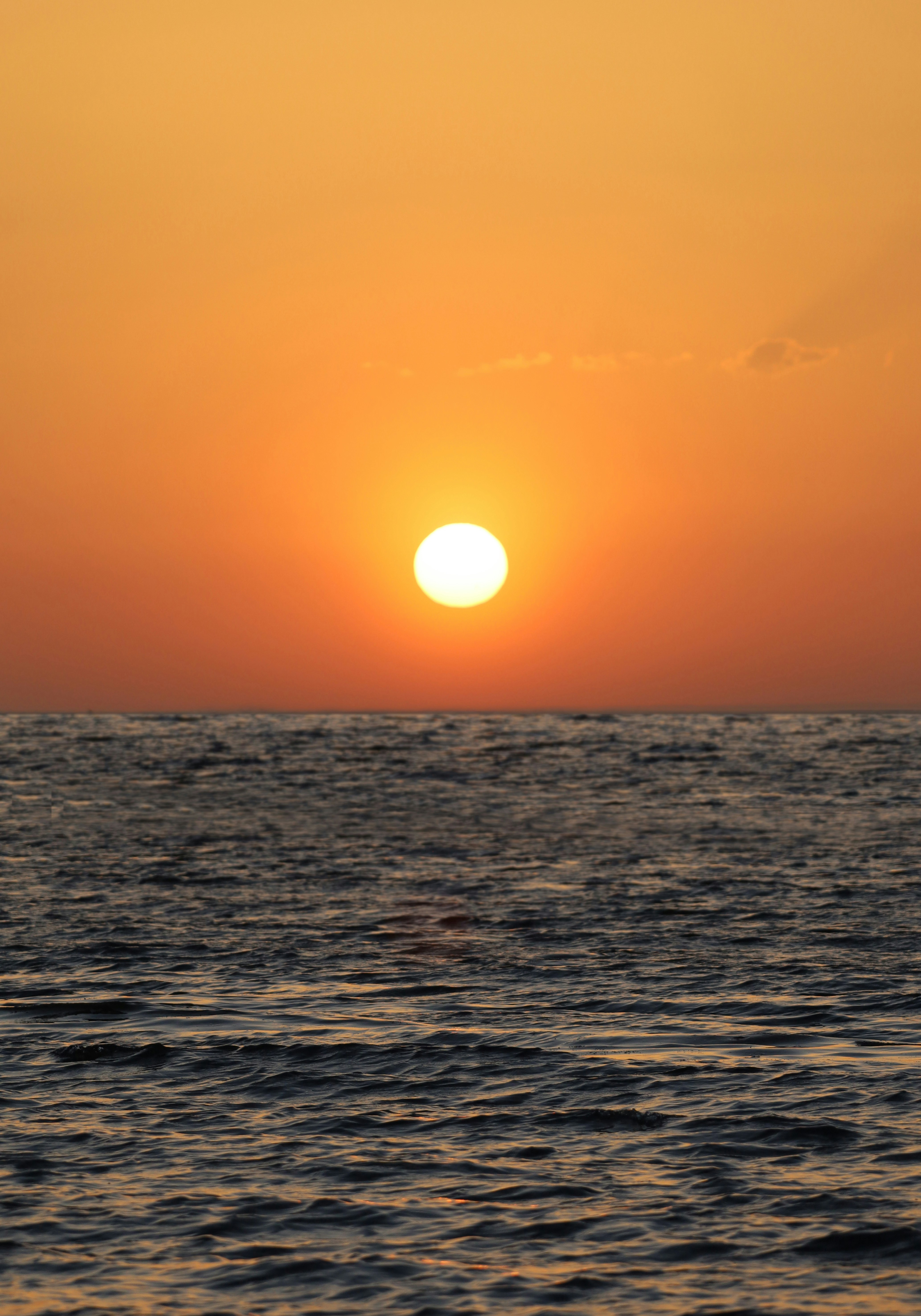 Sunlit Horizon: A Quiet Ocean at Dusk