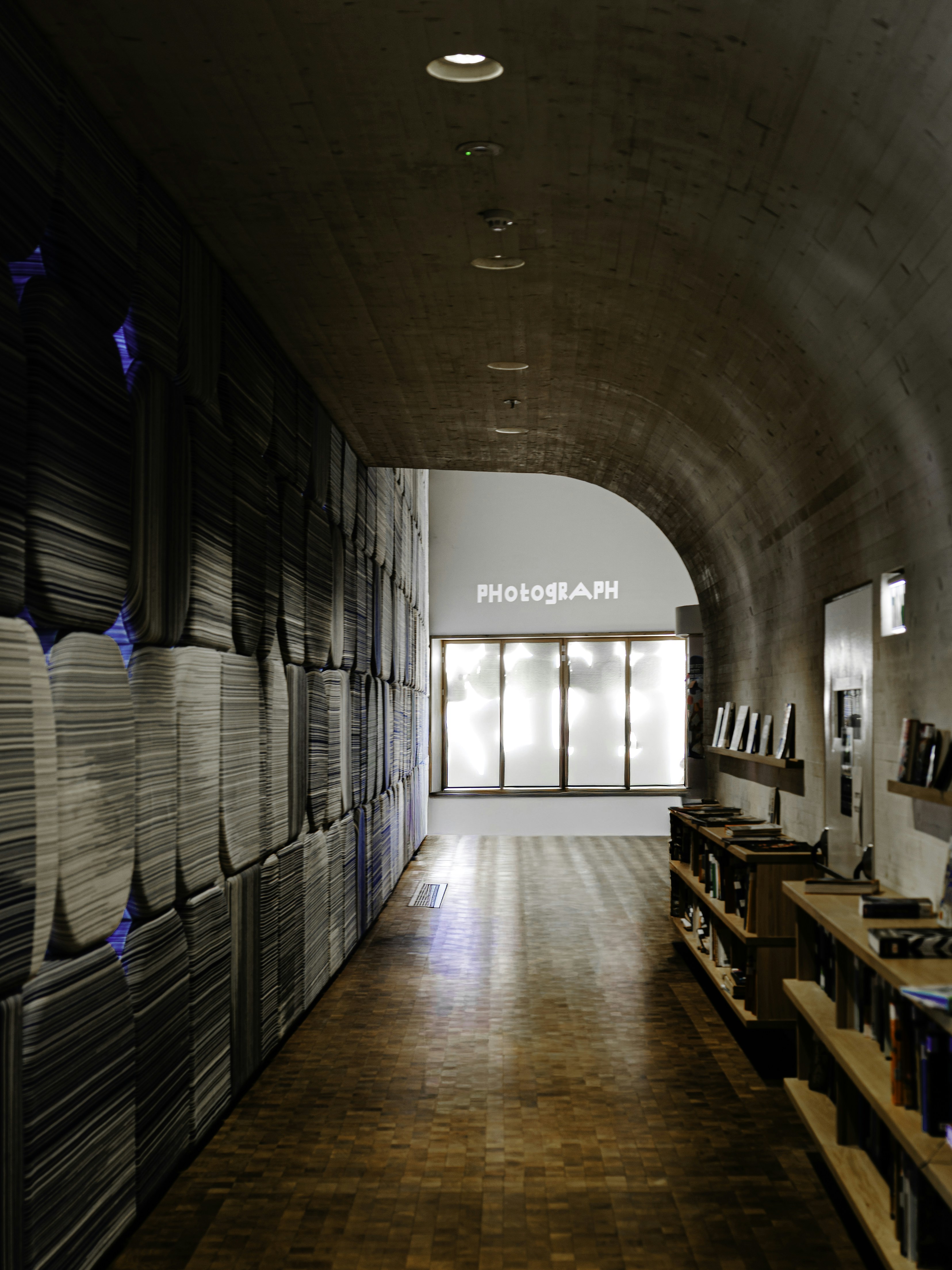 Under the Arched Ceiling: A Quiet Corridor of Books and Light