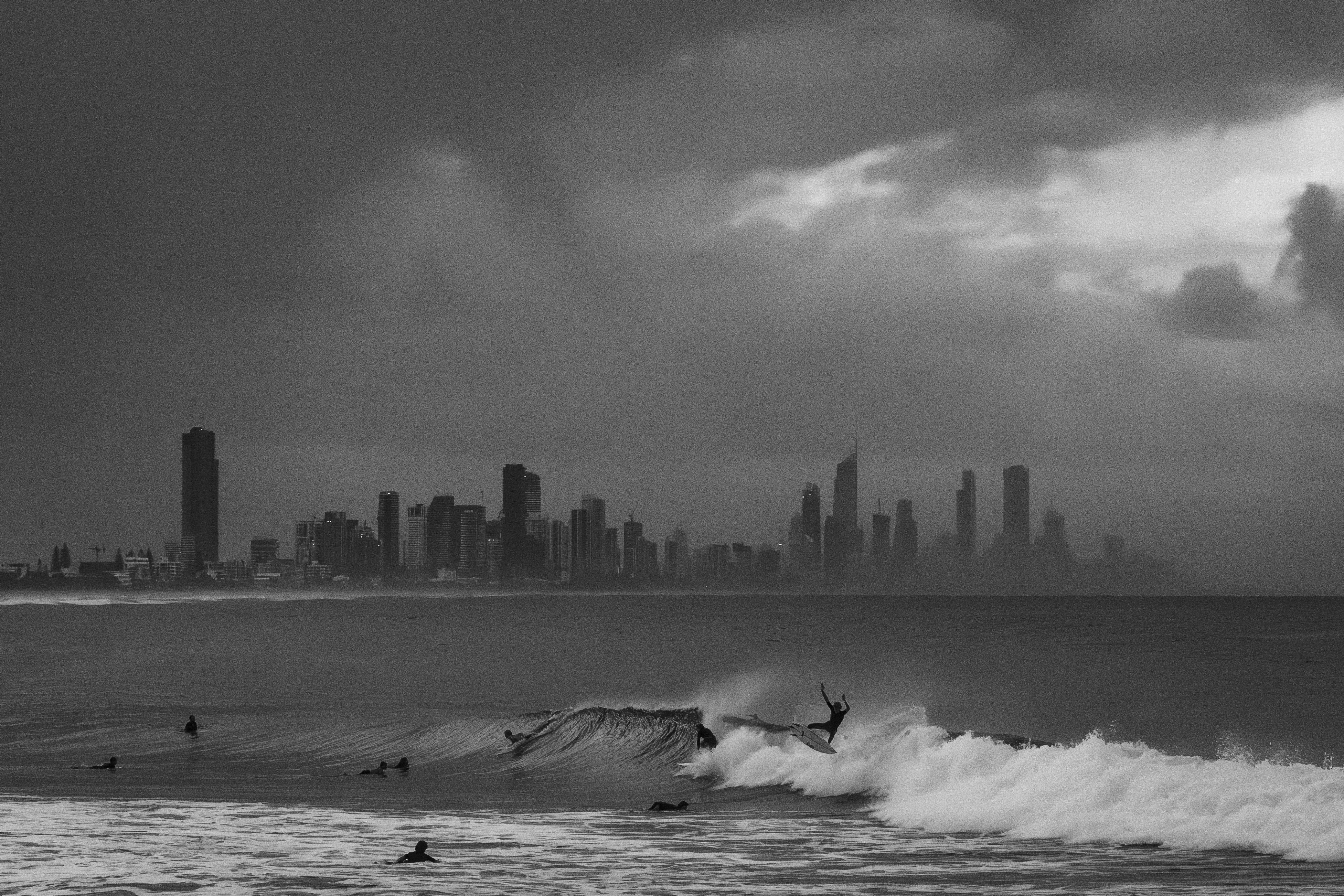Surfer's Silhouette Against a Distant Horizon