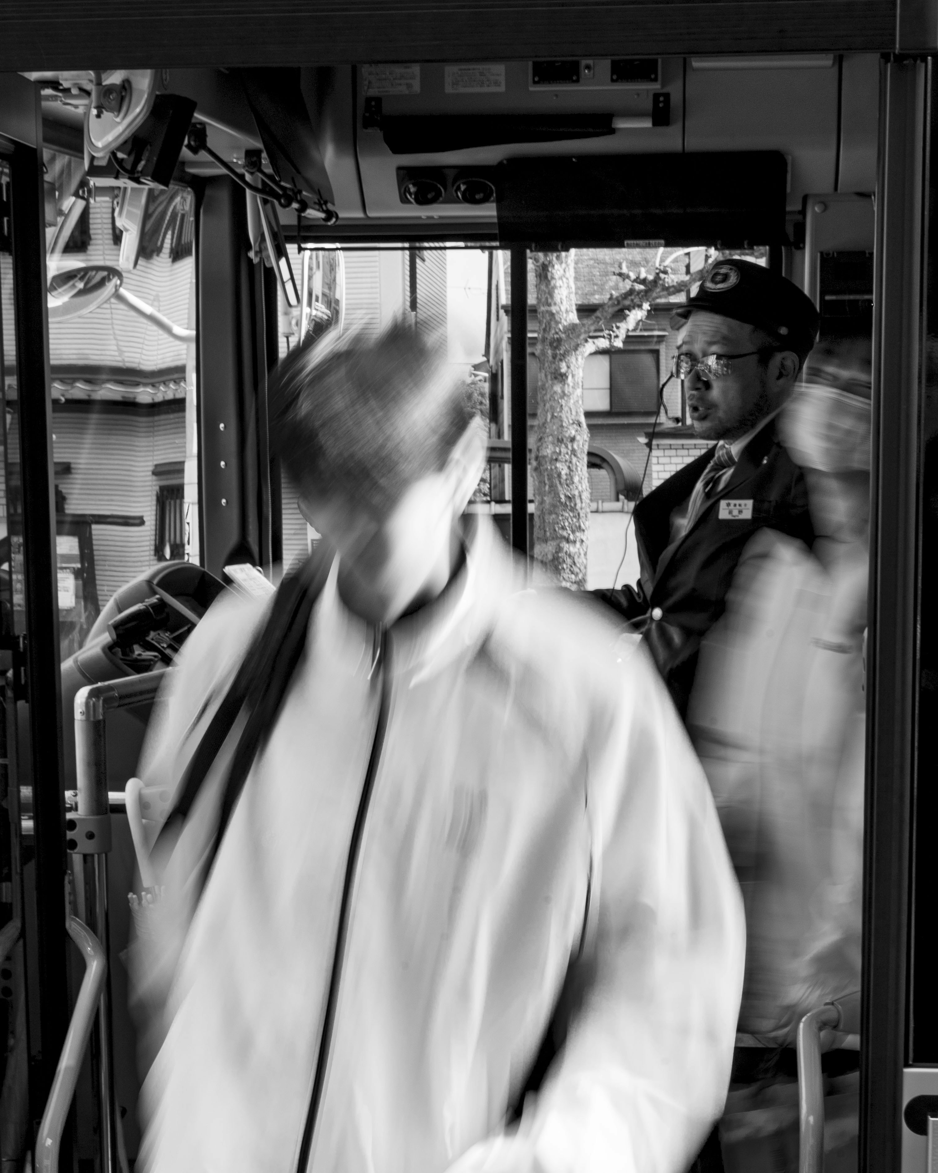 Blurry Commuter in Motion Inside a City Bus