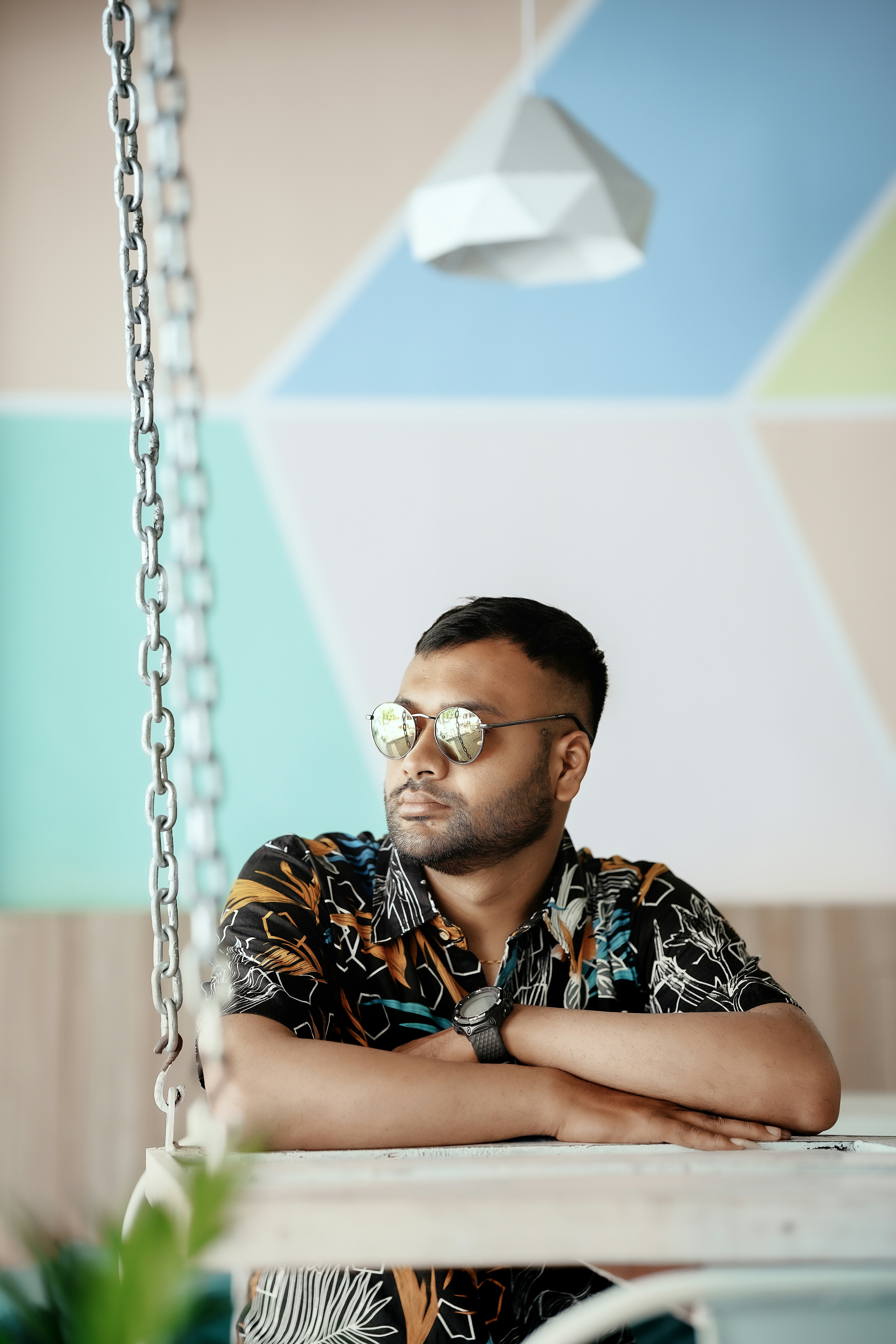 Sunlit Reflections: A Relaxed Portrait in a Colorful Corner
