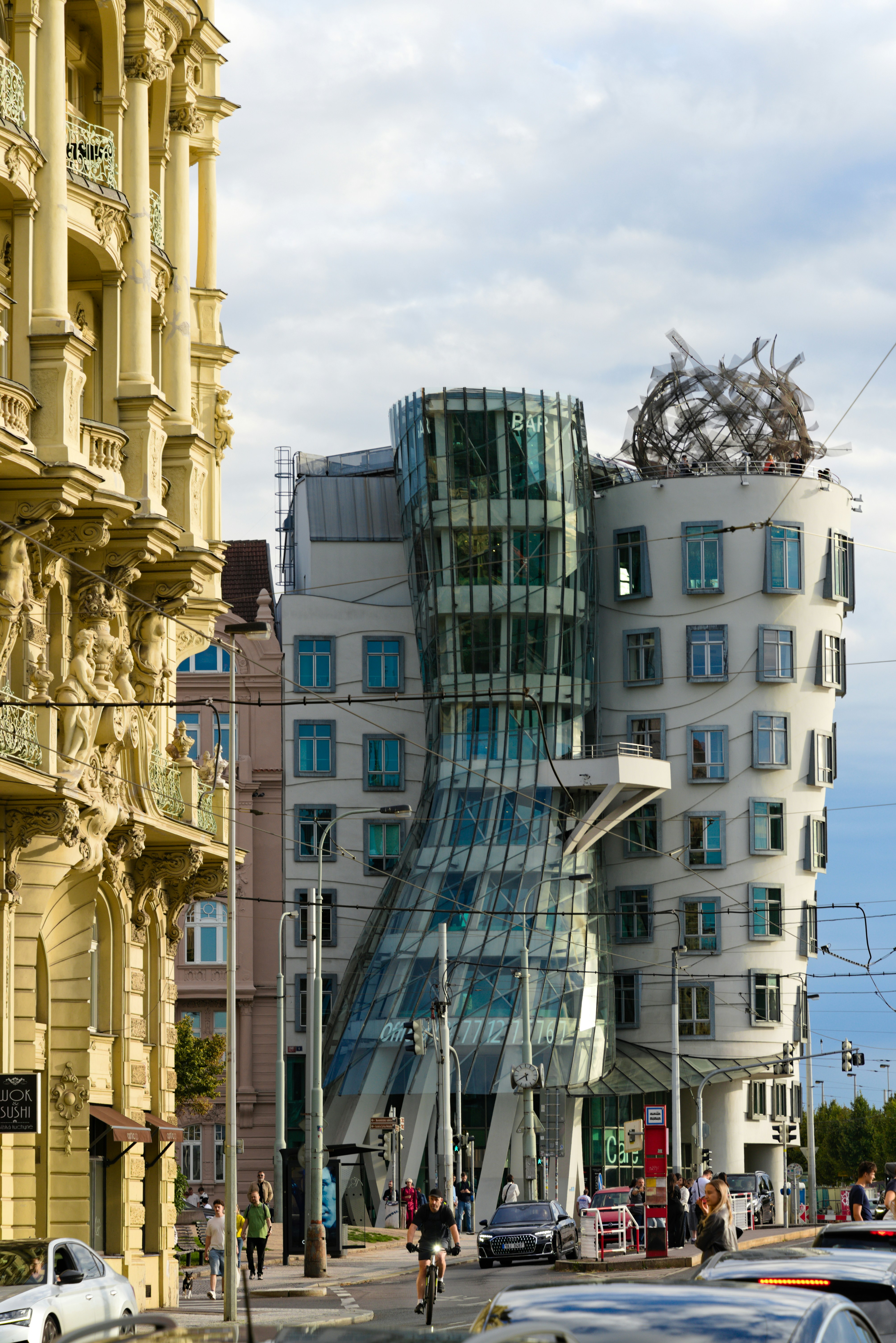 Curved Glass and Cast-iron Facades Meet the Zigzag Studio Tower