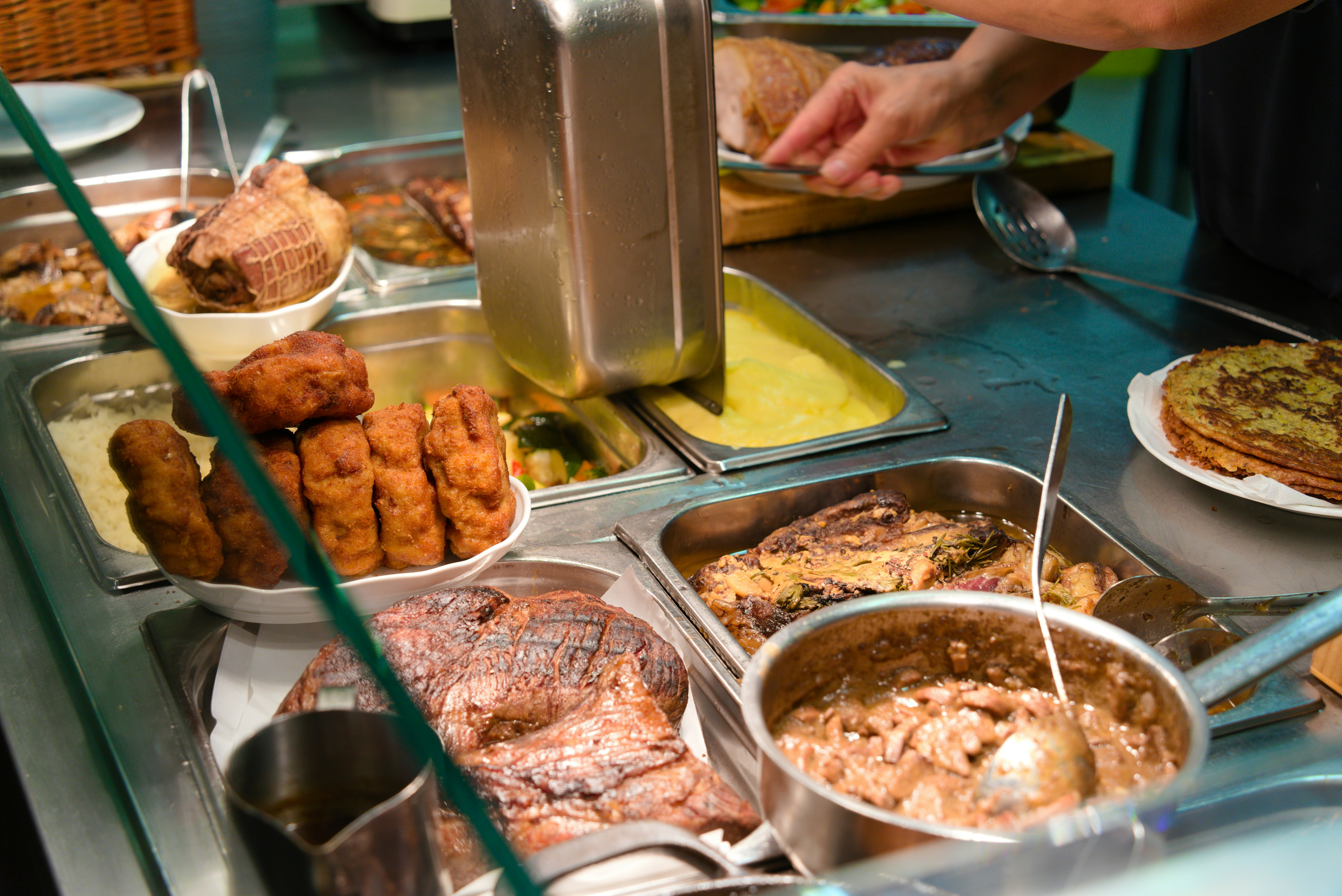 Steam and Sizzle at the Buffet: A Glimpse into the Warm Kitchen Parade