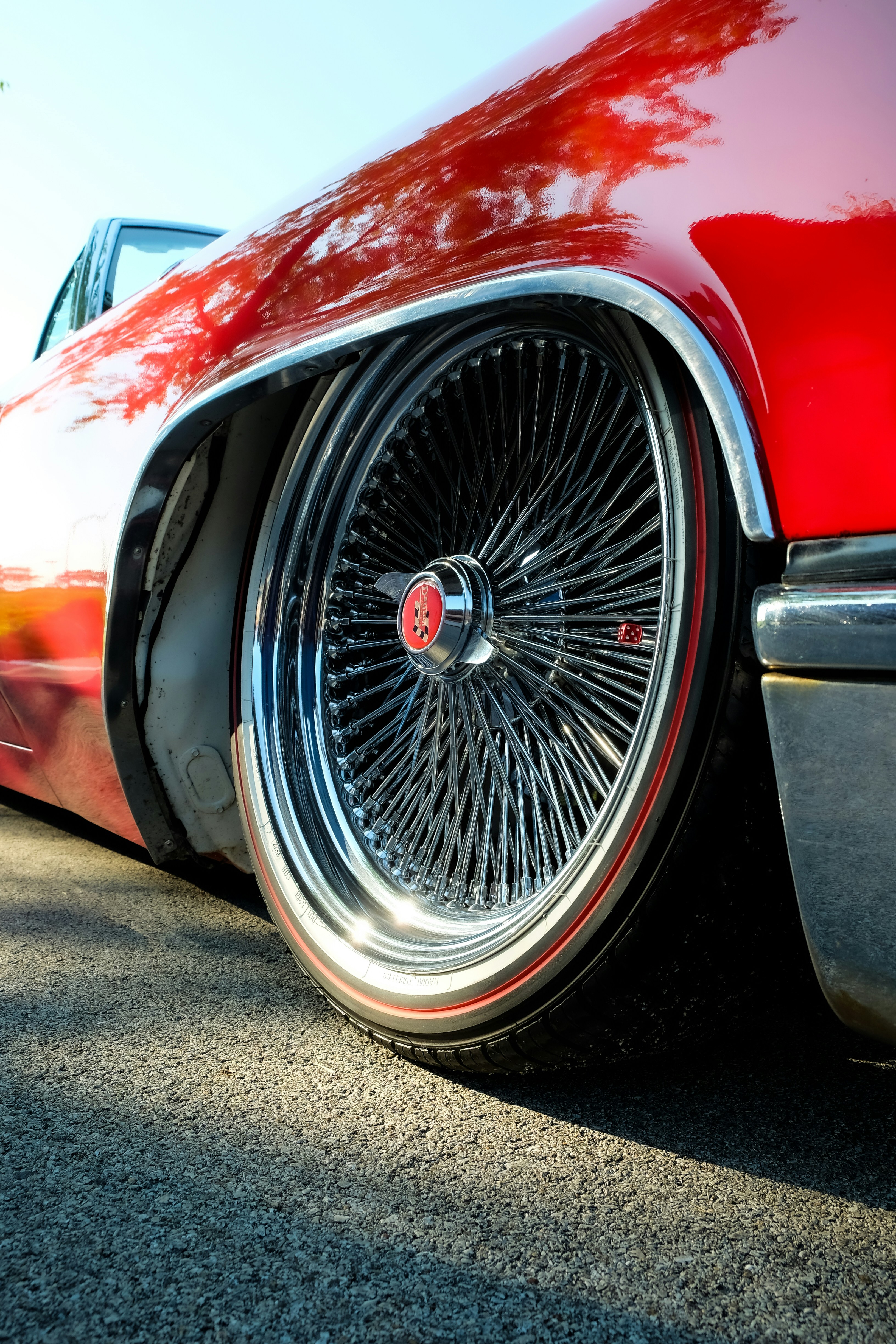 Low-Angle Chrome: A Red Classic's Wheel in Detail