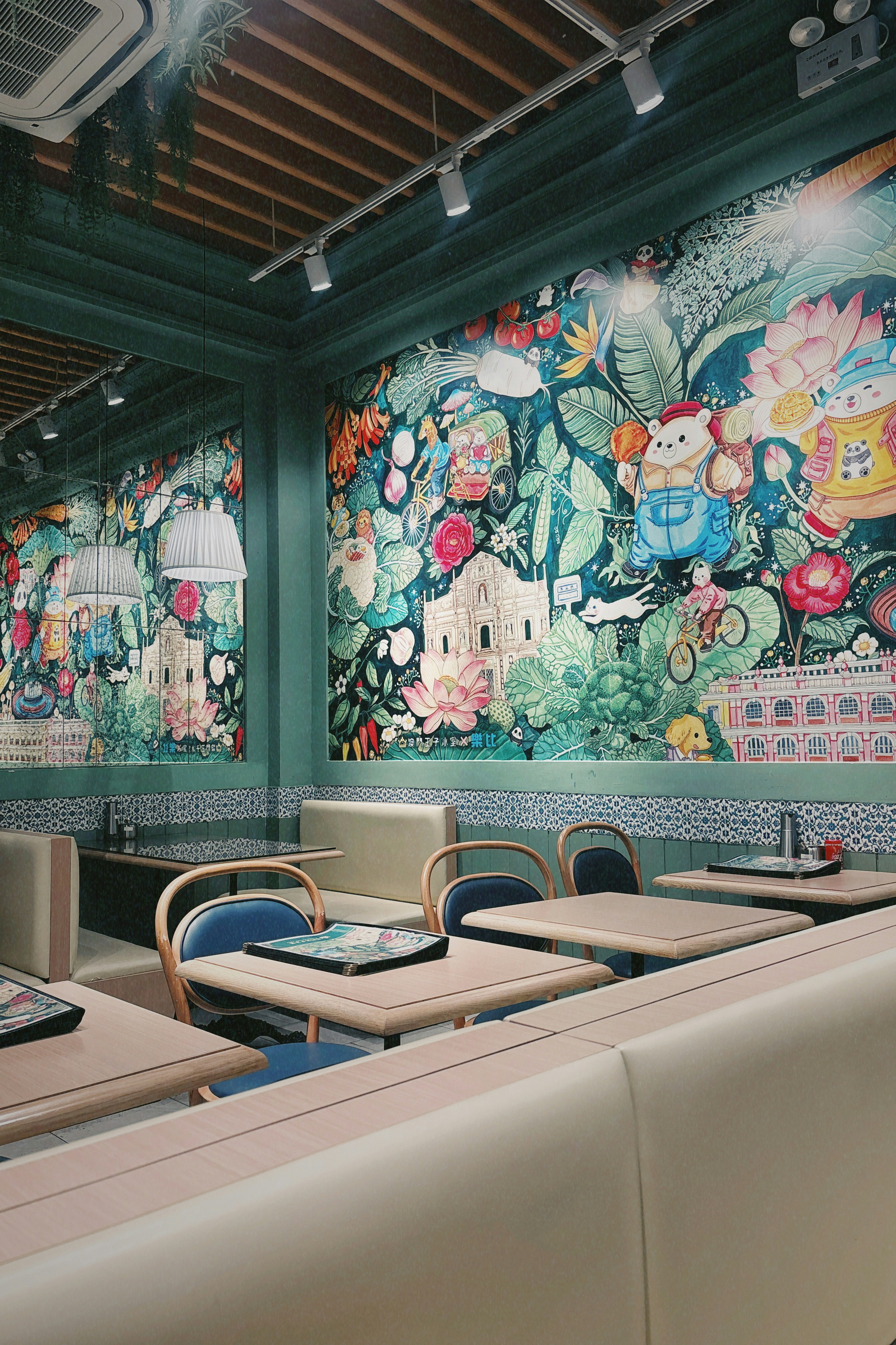 Vibrant Café Wall: Cartoonish Mural Enlivening a Quiet Lounge