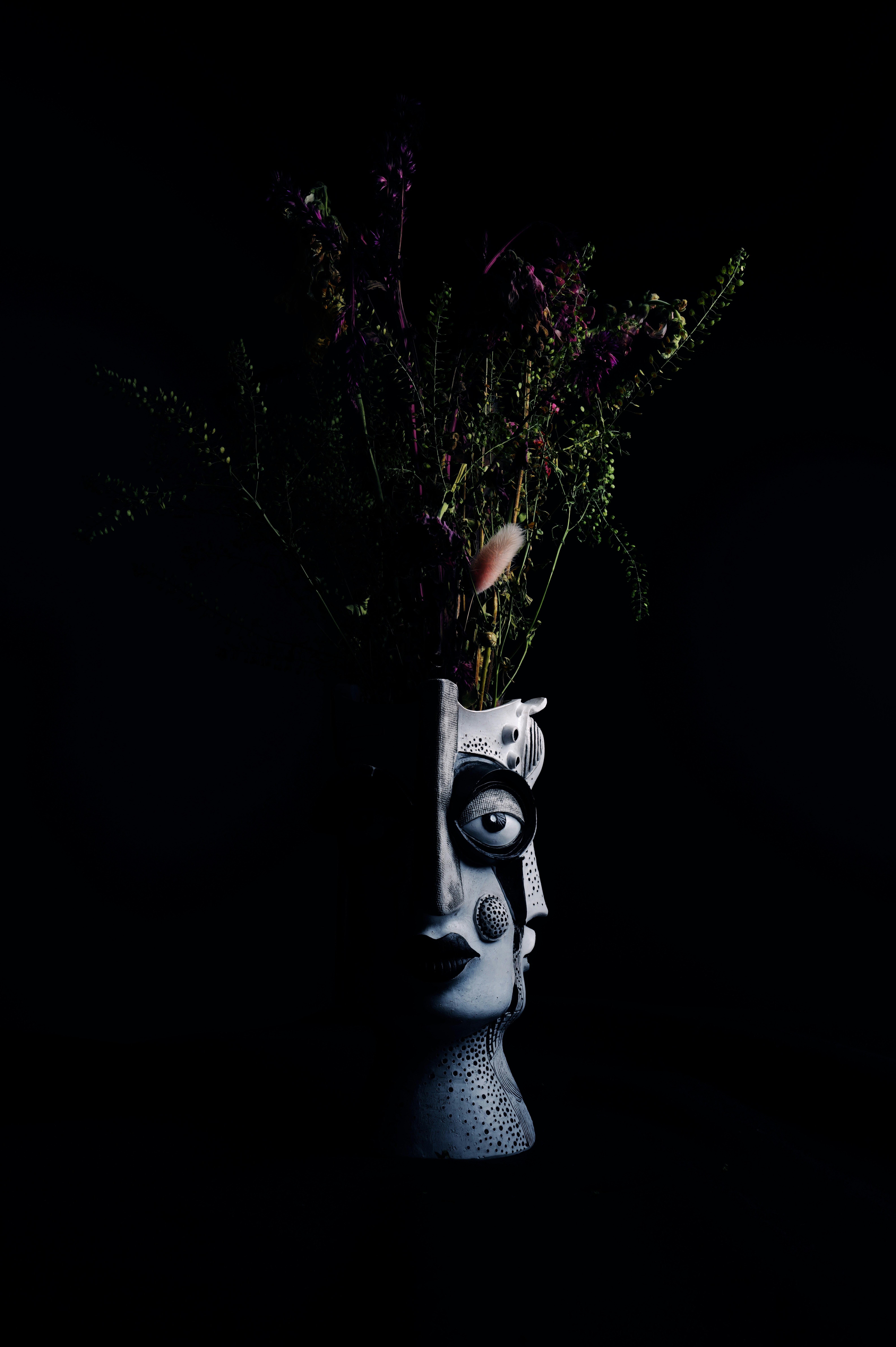 Portrait Vessel: A Ceramic Face with Wildflower Crown Emerging from Night
