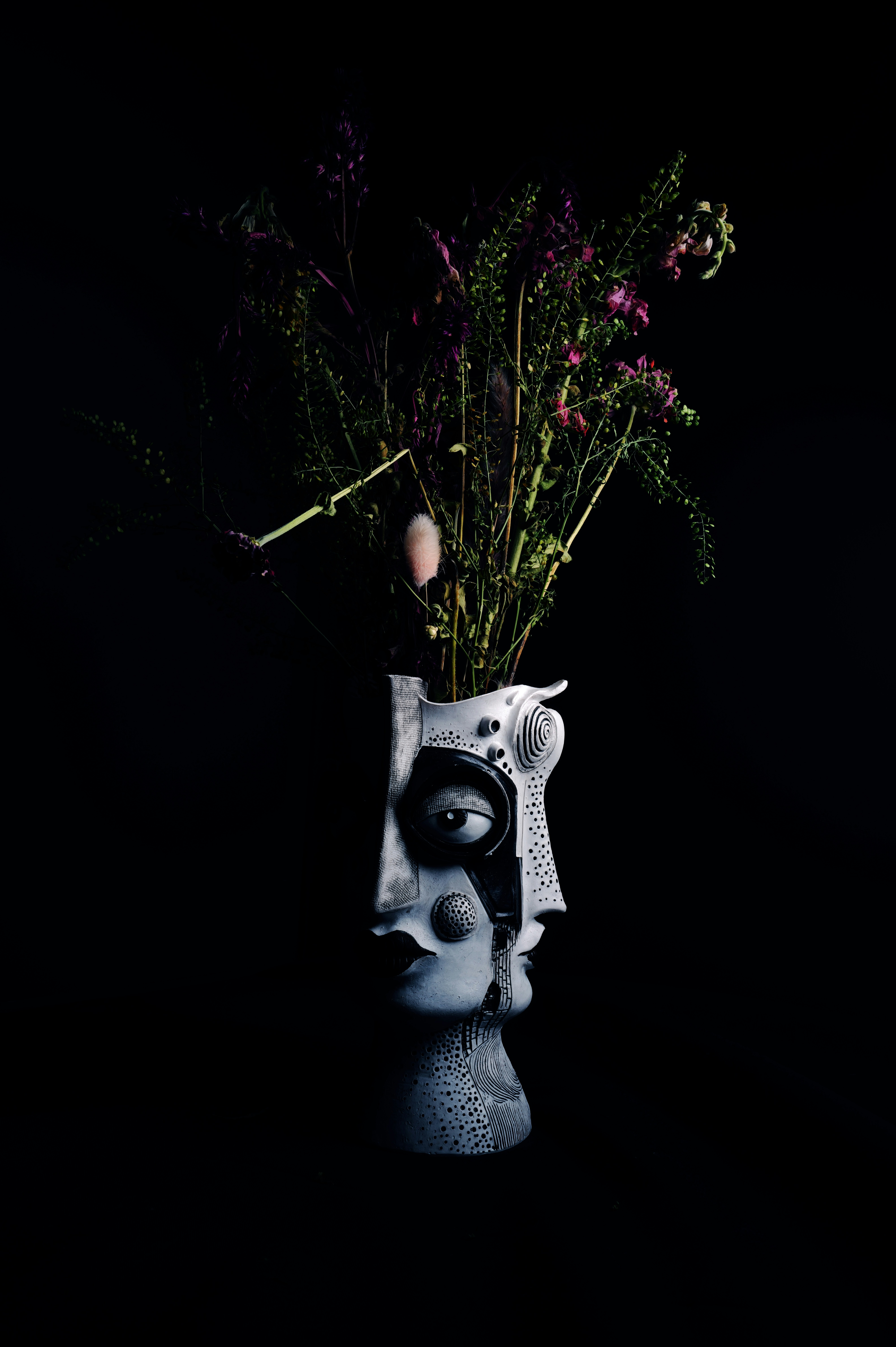 Vessel of Silence: A Floral Absurdity Emerging from a Sculpted Mask