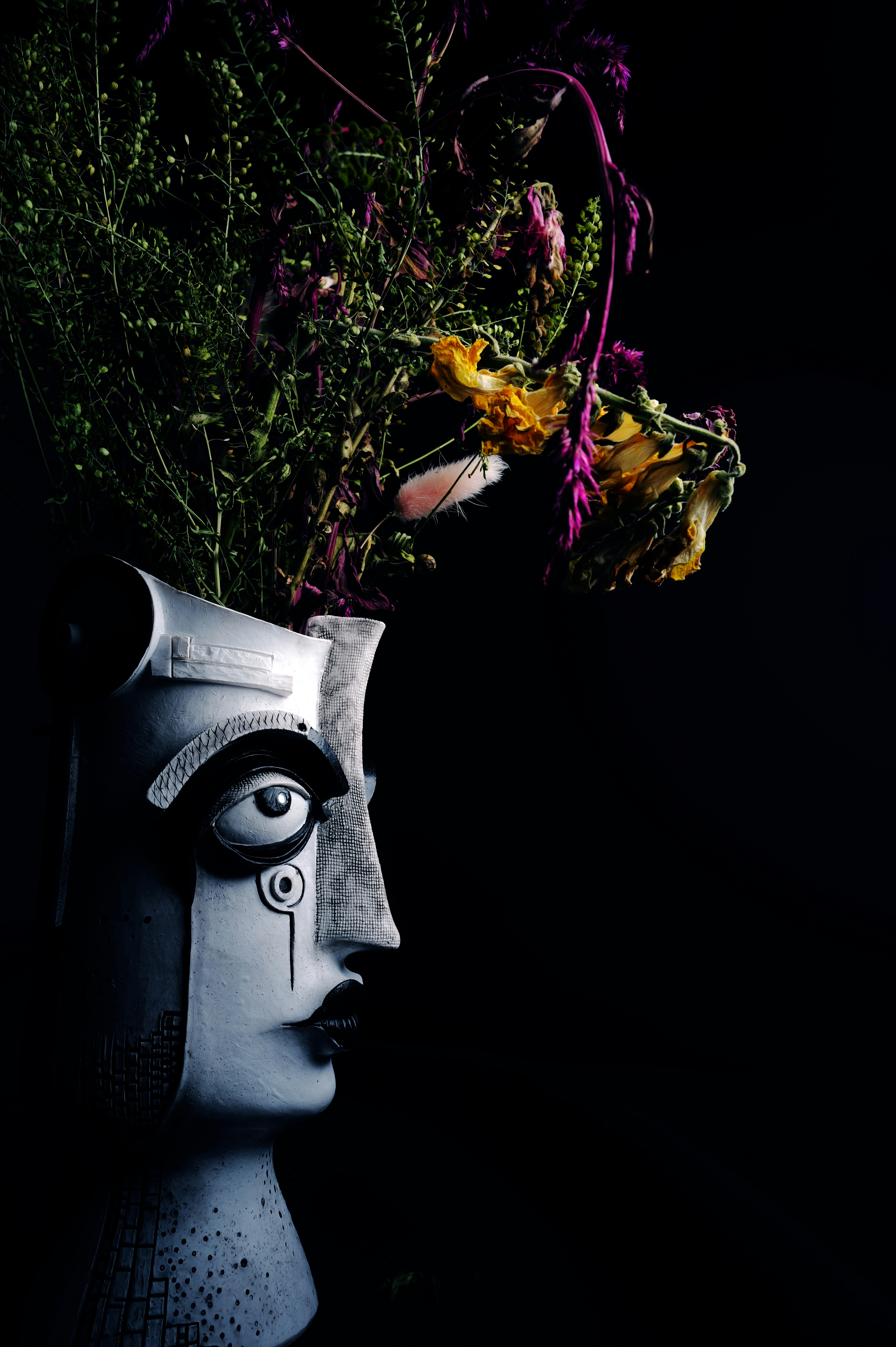Vessel of Shadows: A Floral Headdress Embracing a Robotic Mask