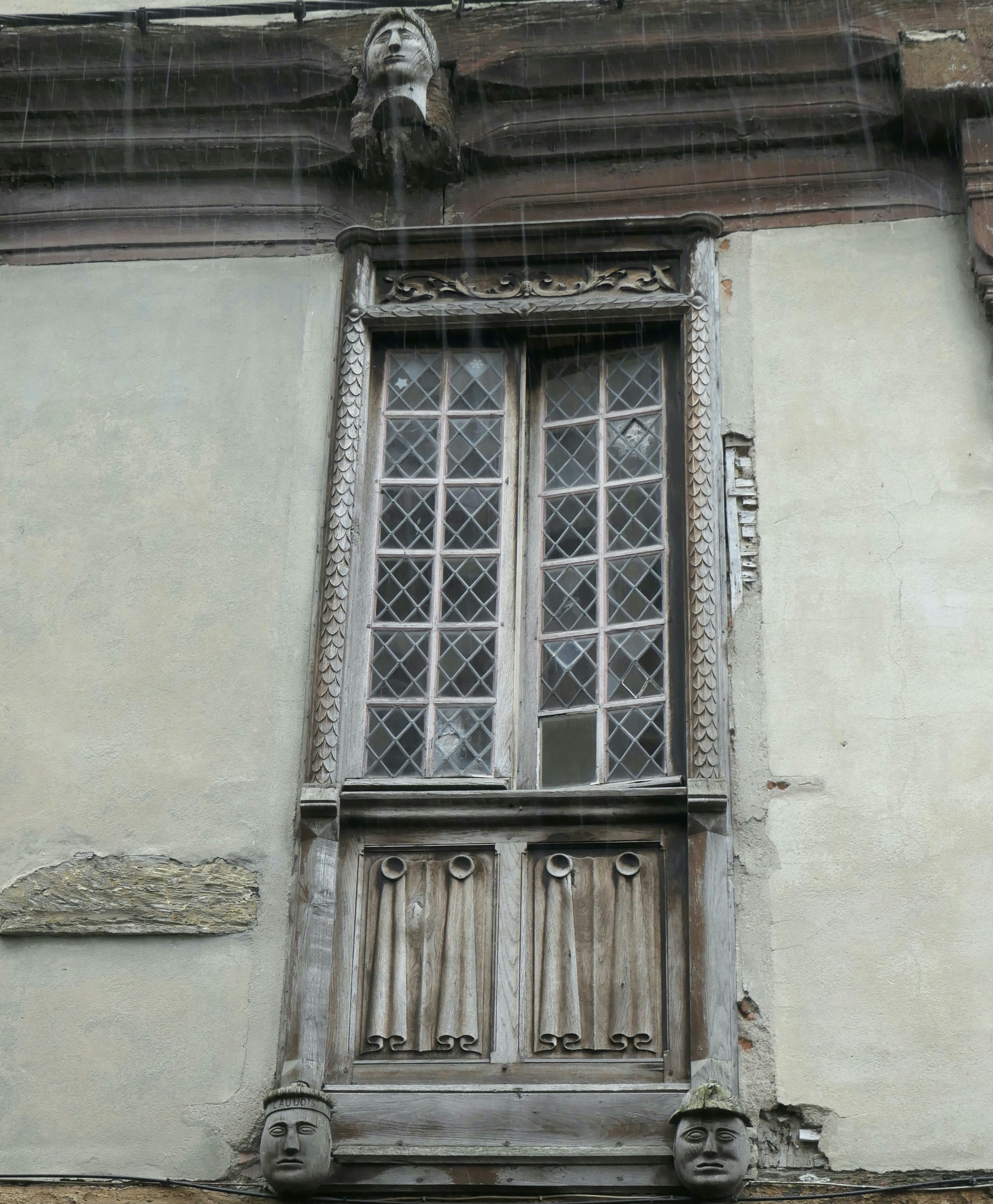 Weathered Window Gatekeeper: A Dormer of Stone and Glass